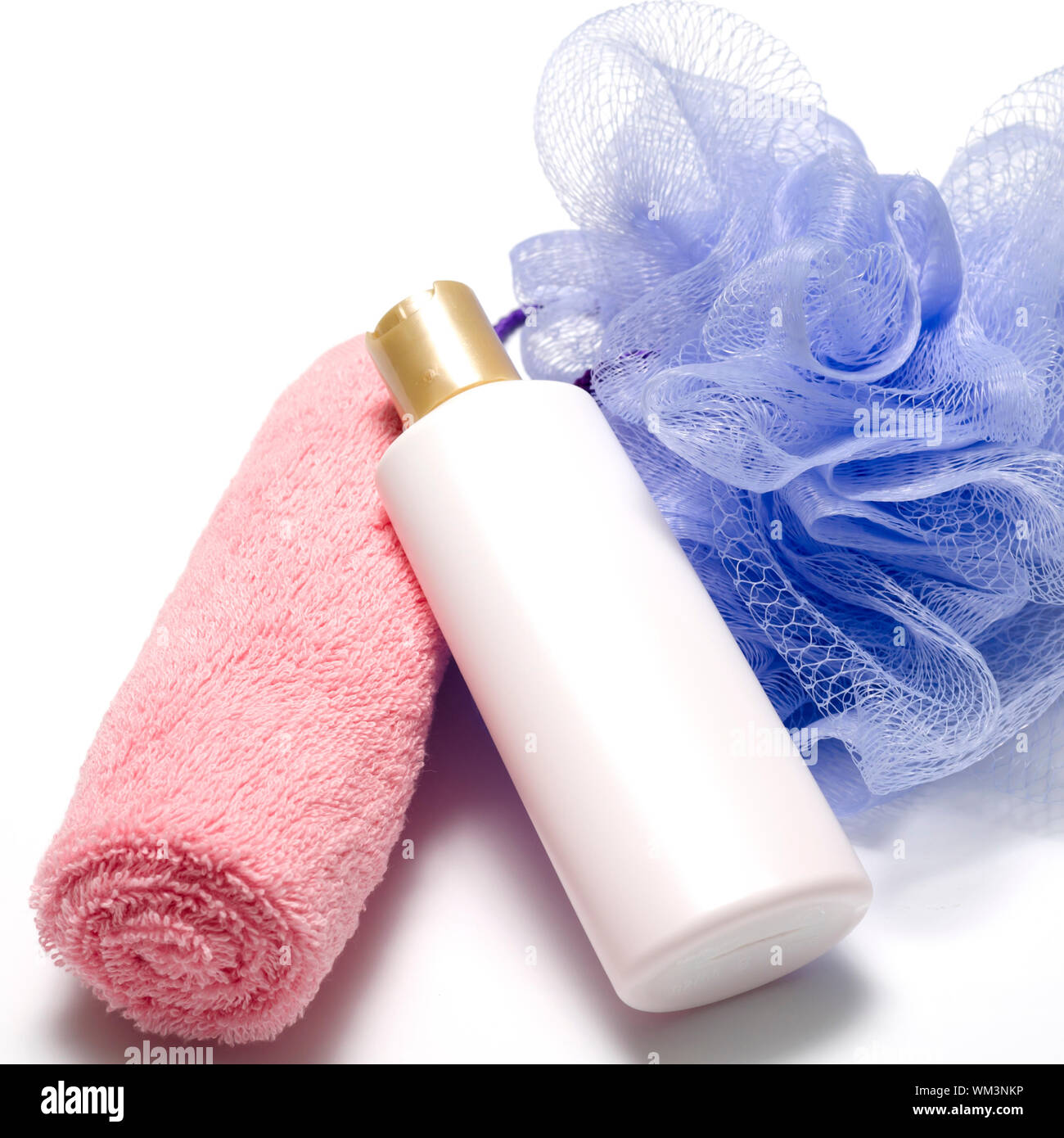 purple bath puff liquid soap and pink towel on a white background Stock ...