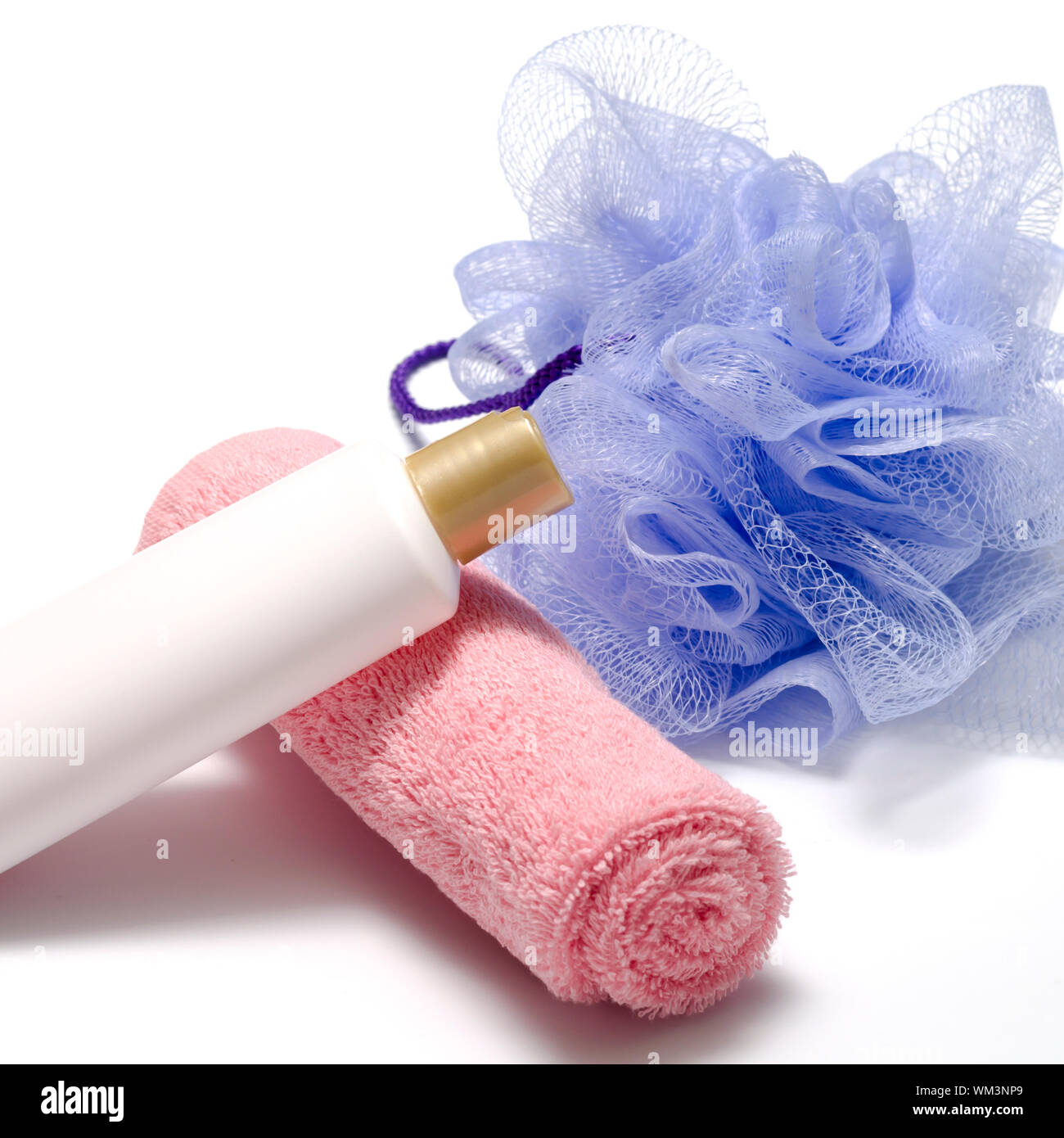 purple bath puff liquid soap and pink towel on a white background Stock ...