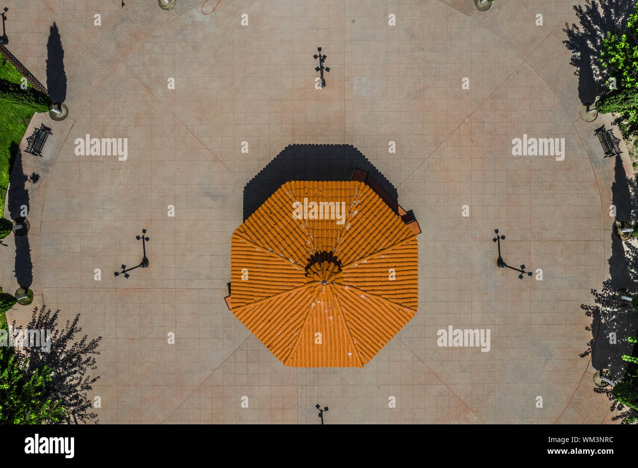 Aerial view of orange octagonal kiosk in the center of the public ...