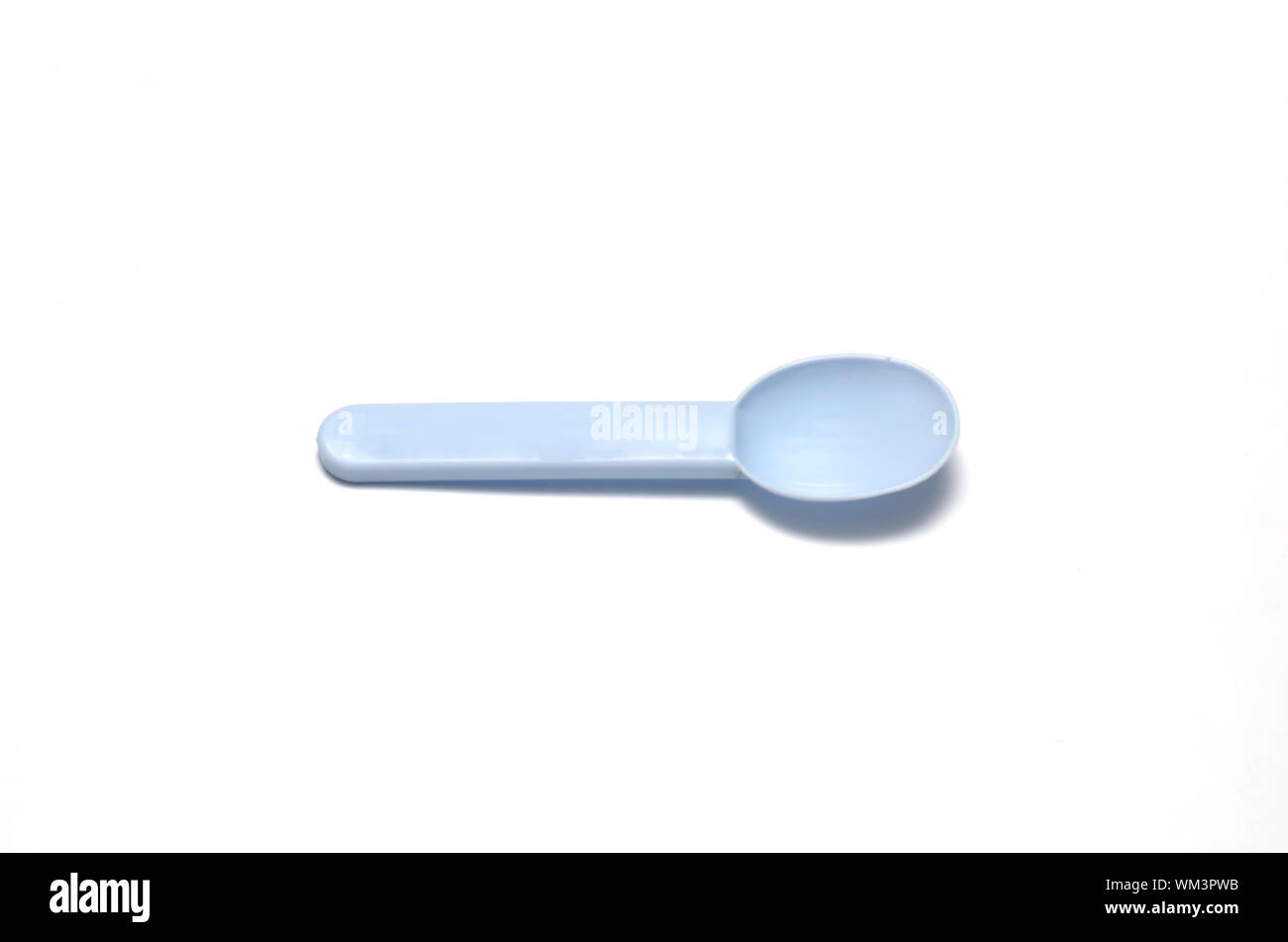 blue plastic spoon on a white background Stock Photo - Alamy