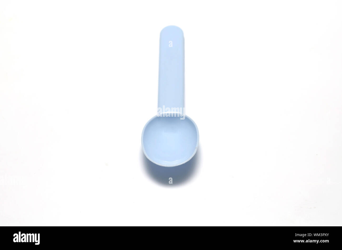 blue plastic spoon on a white background Stock Photo - Alamy
