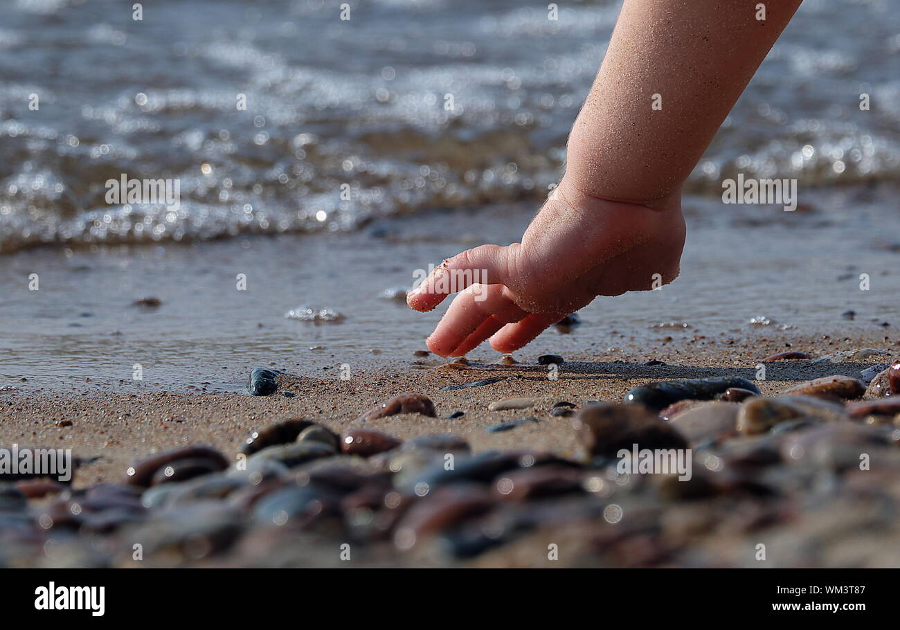 Child close up touching hi-res stock photography and images - Alamy