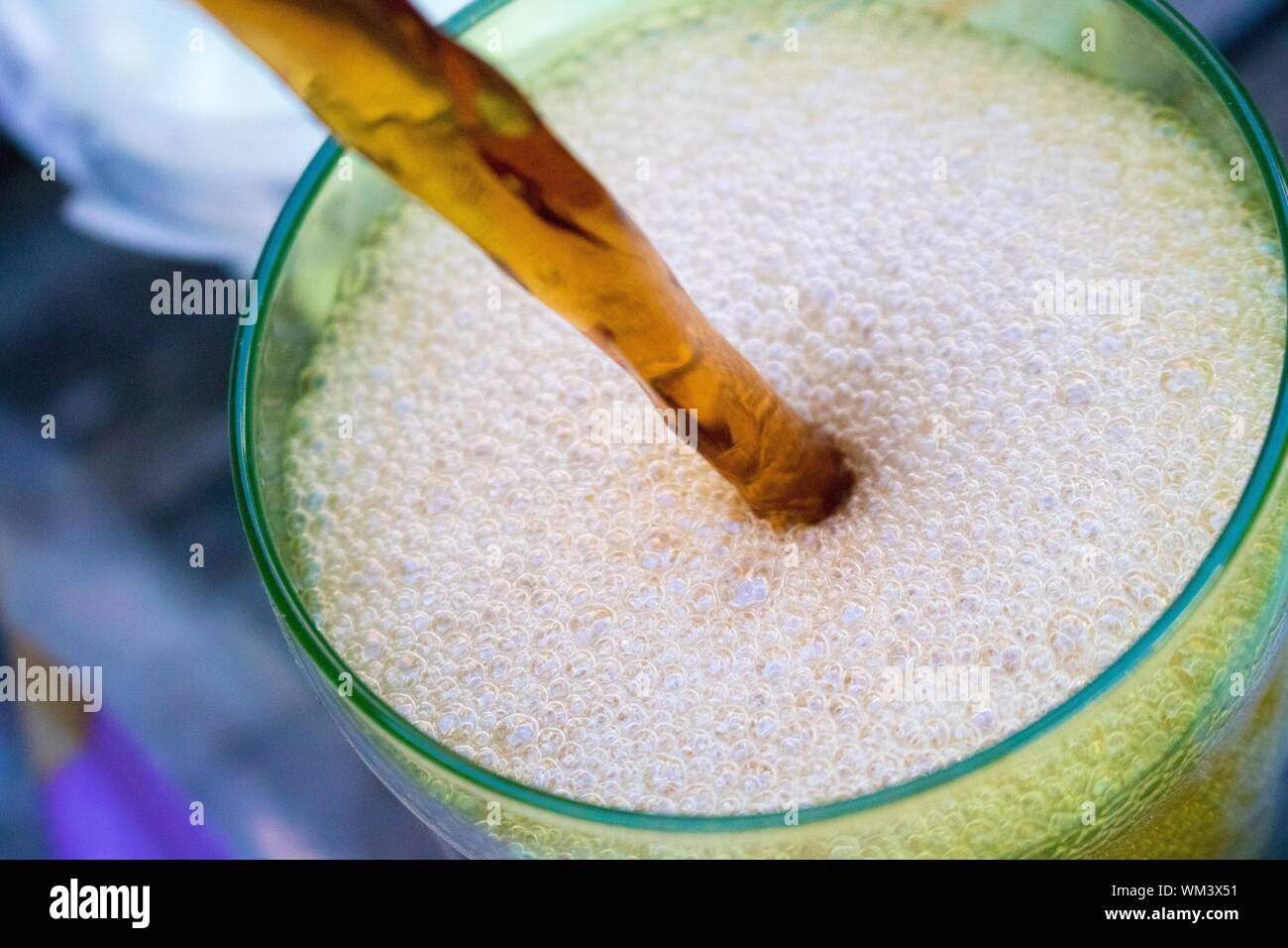 Drink Pouring In Glass Stock Photo - Alamy