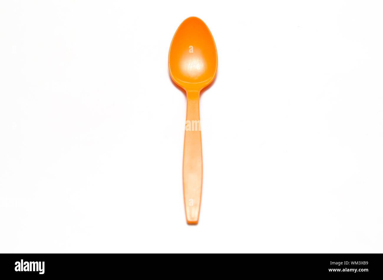 orange plastic spoon Stock Photo - Alamy