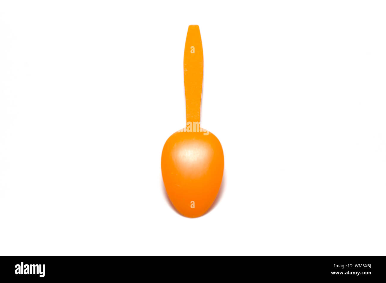 orange plastic spoon Stock Photo - Alamy