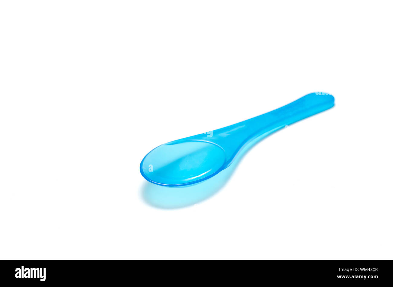 blue plastic spoon on a white background Stock Photo - Alamy