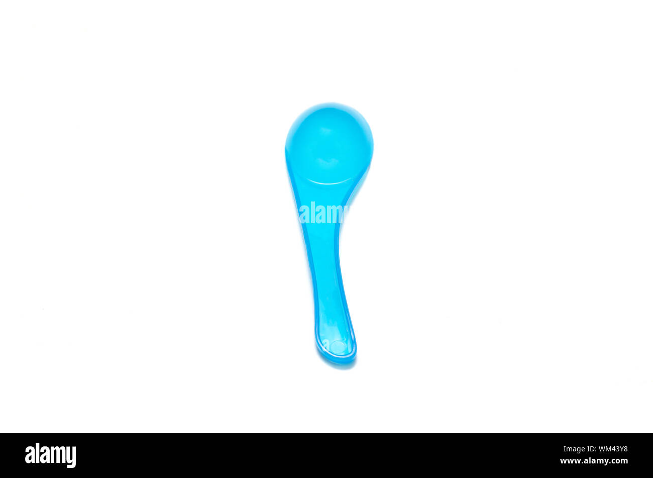 blue plastic spoon on a white background Stock Photo - Alamy