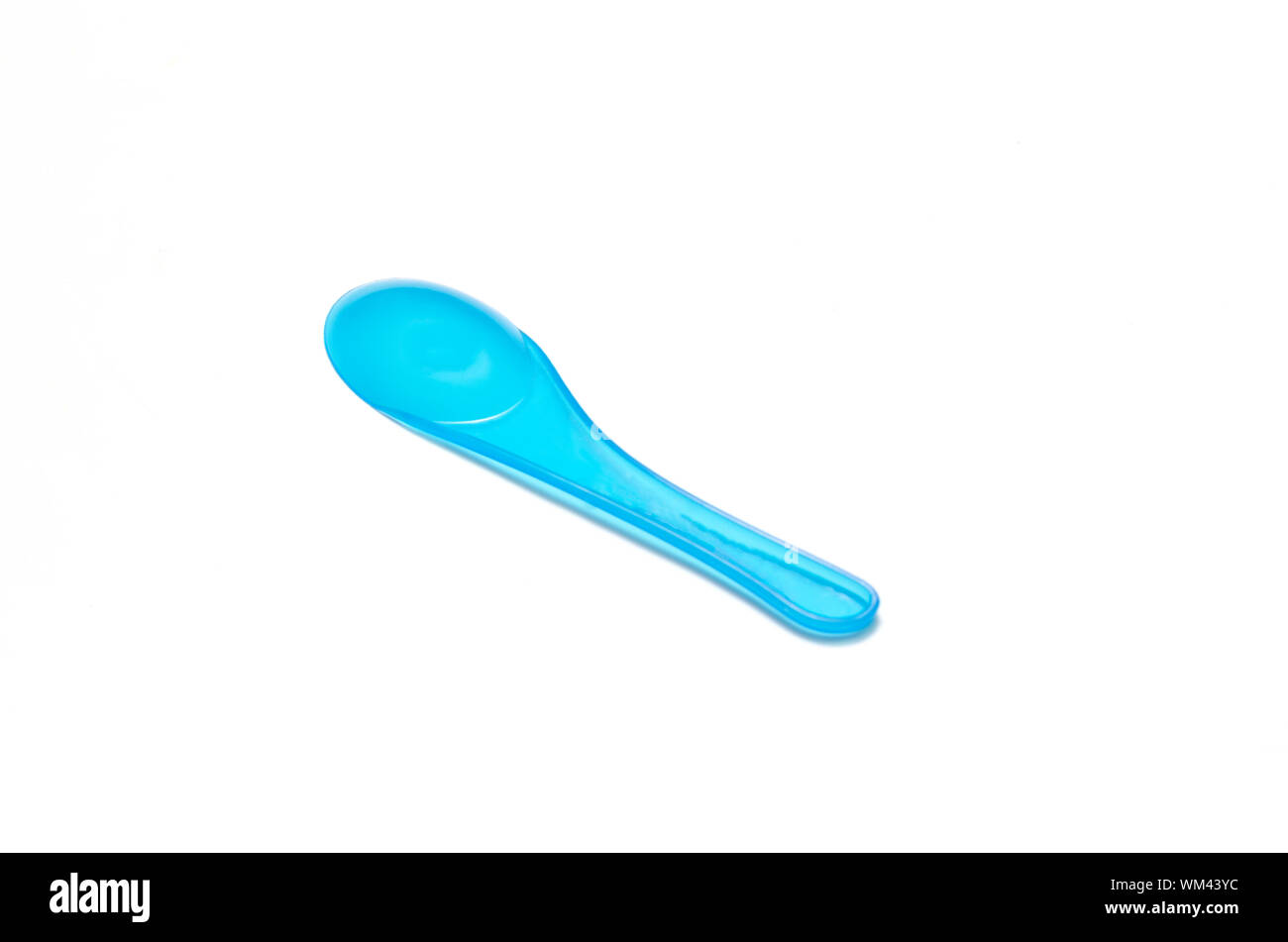 blue plastic spoon on a white background Stock Photo - Alamy