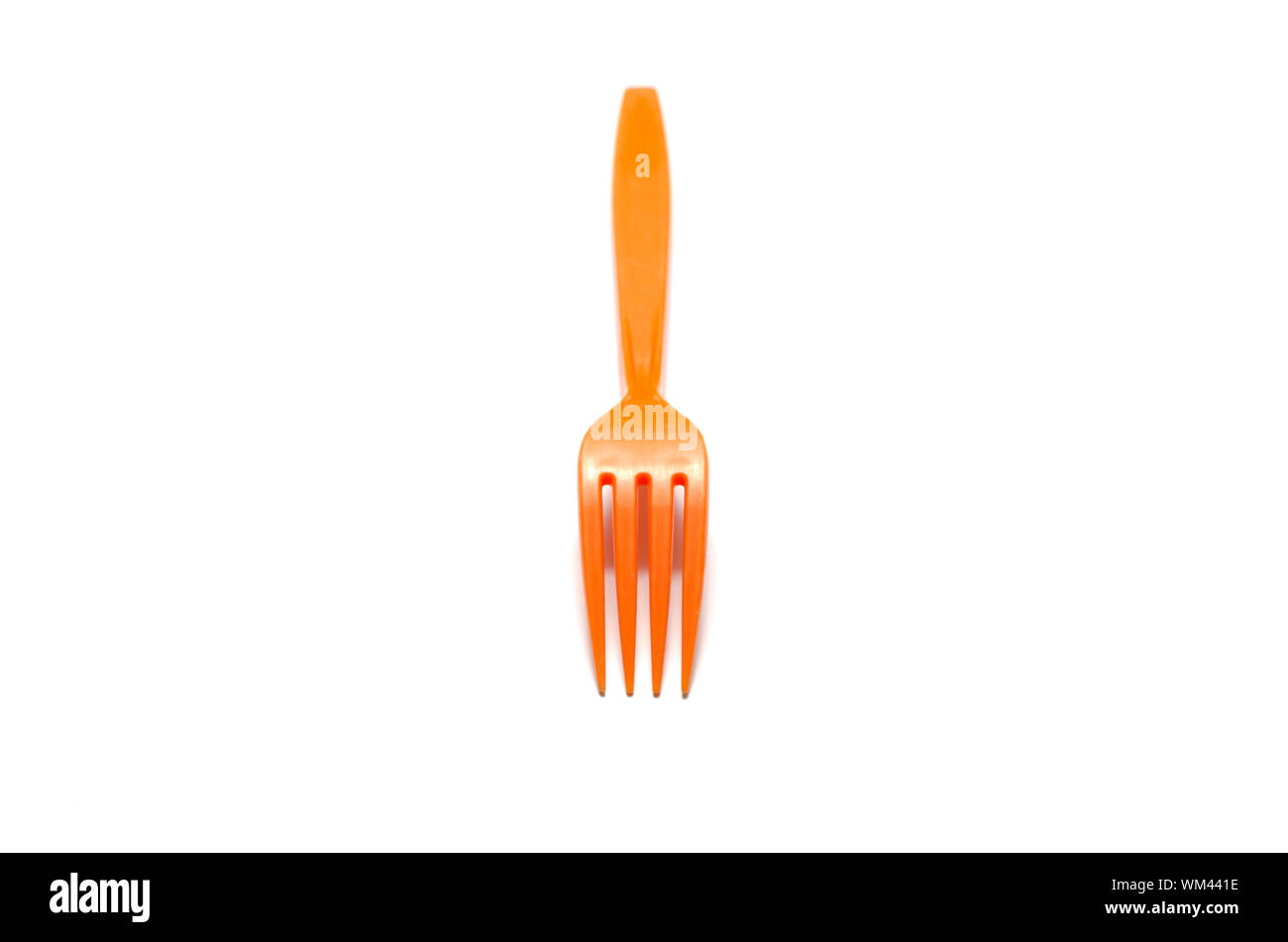 orange plastic fork on a white background Stock Photo - Alamy