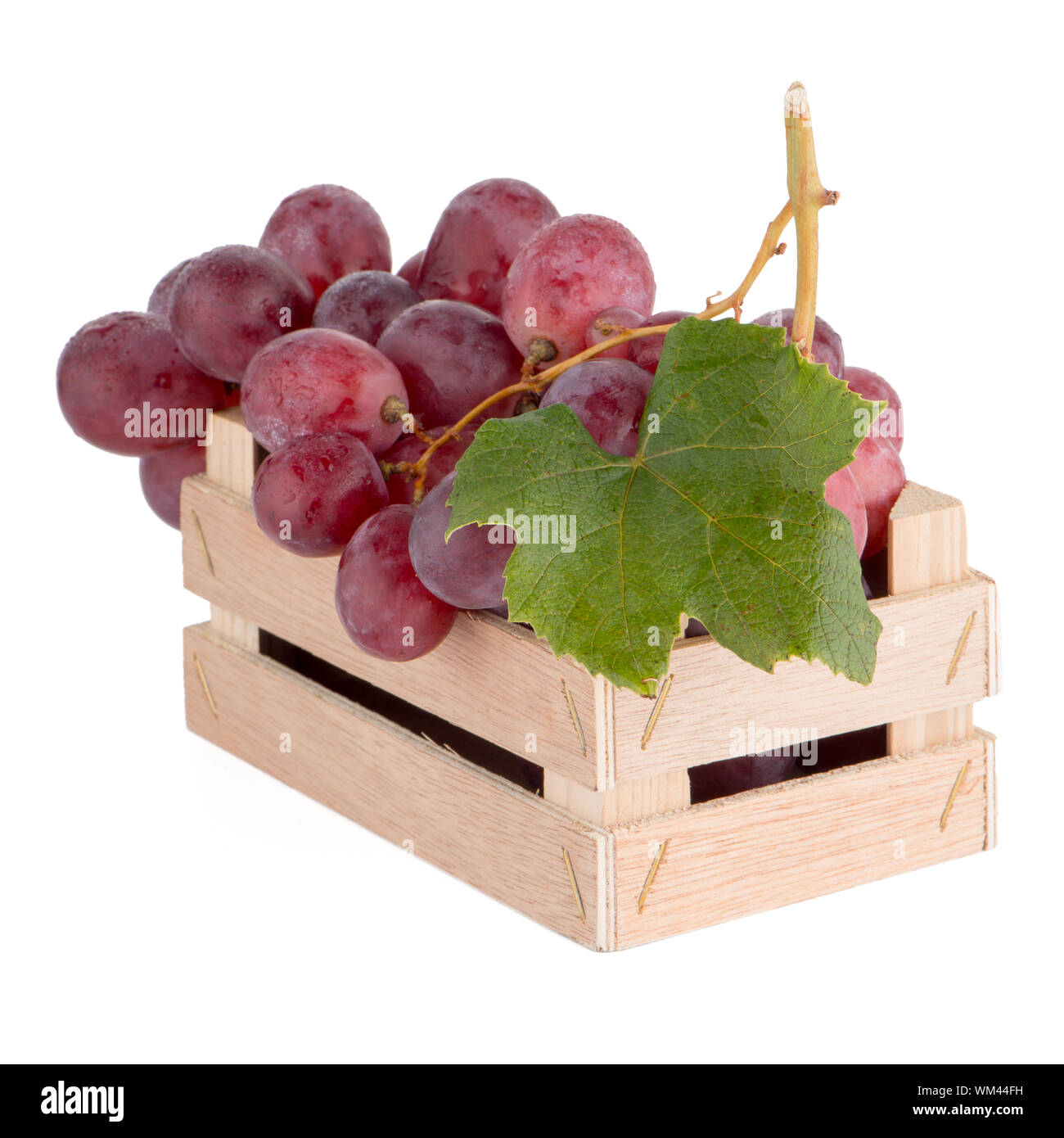Red grapes in wooden crate isolated on white background Stock Photo - Alamy