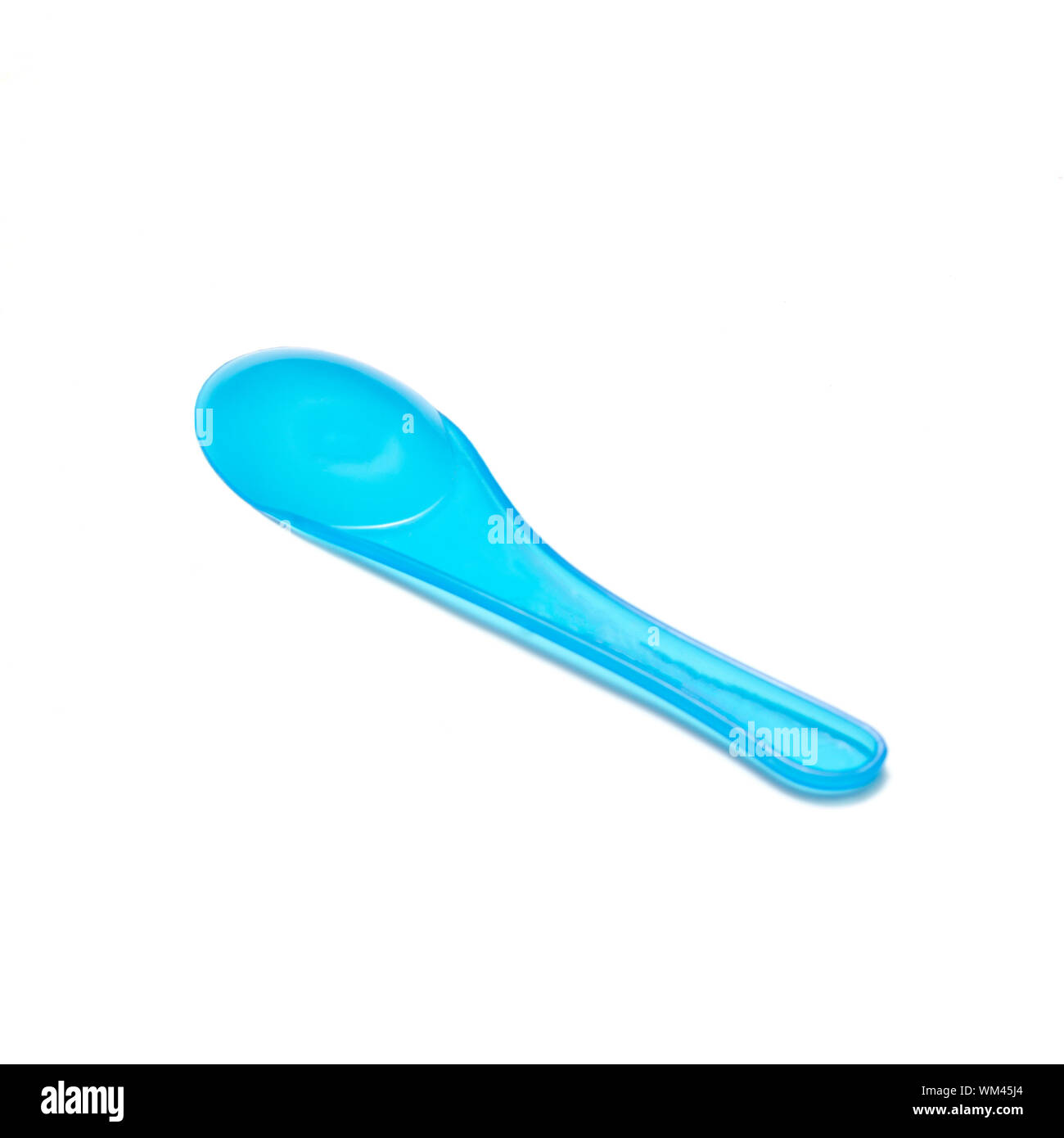 blue plastic spoon on a white background Stock Photo - Alamy