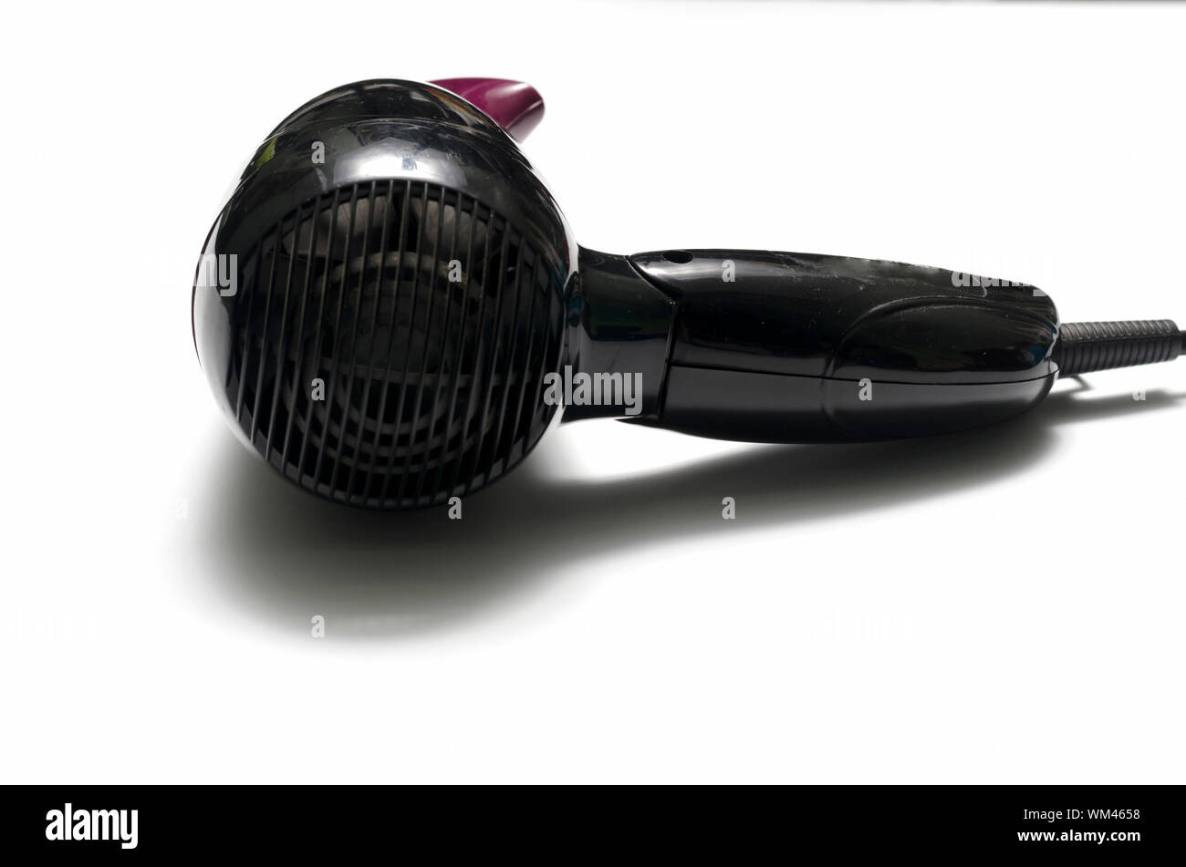 old used electric hair dryer on a white background Stock Photo - Alamy