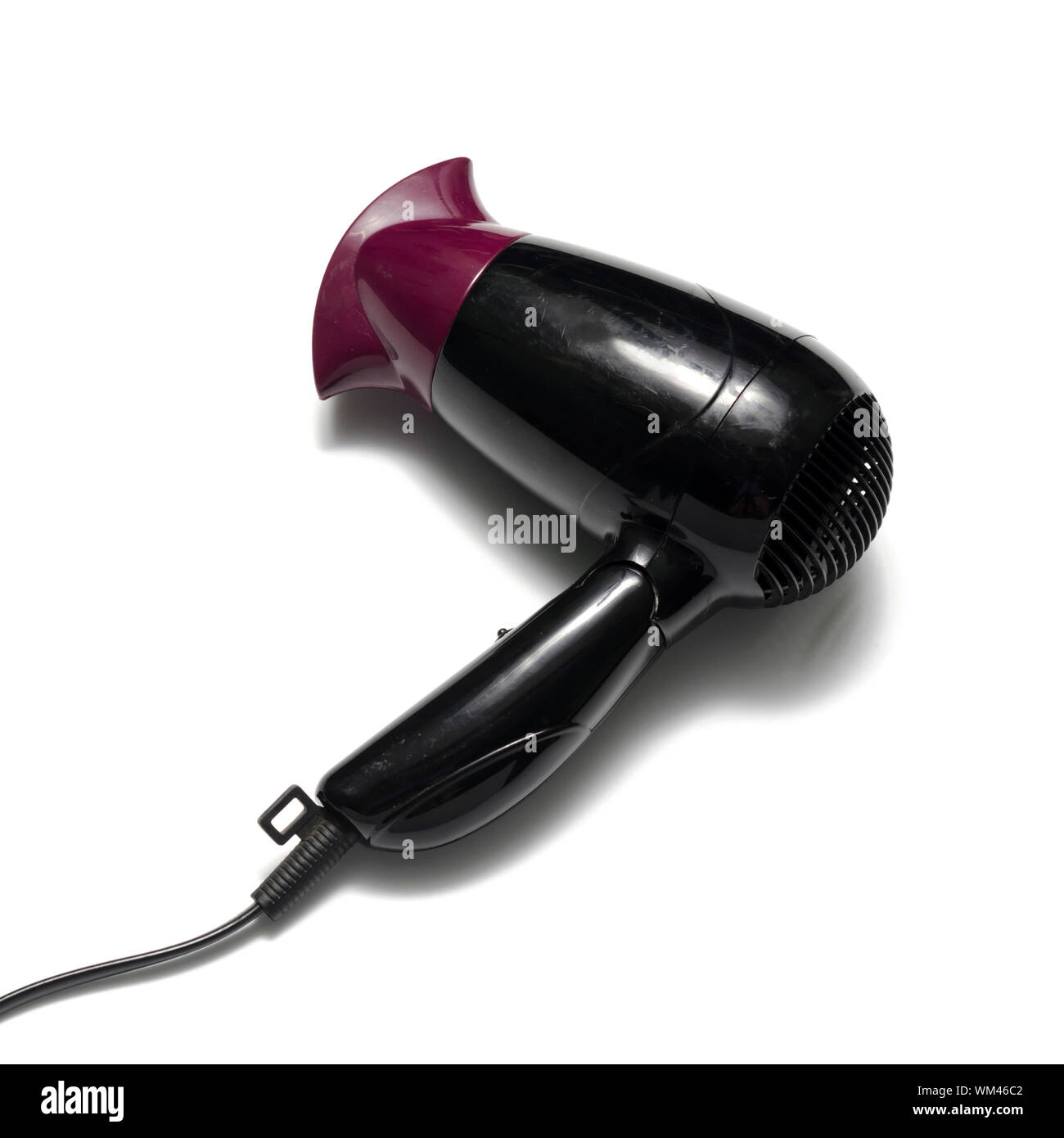 old used electric hair dryer on a white background Stock Photo - Alamy