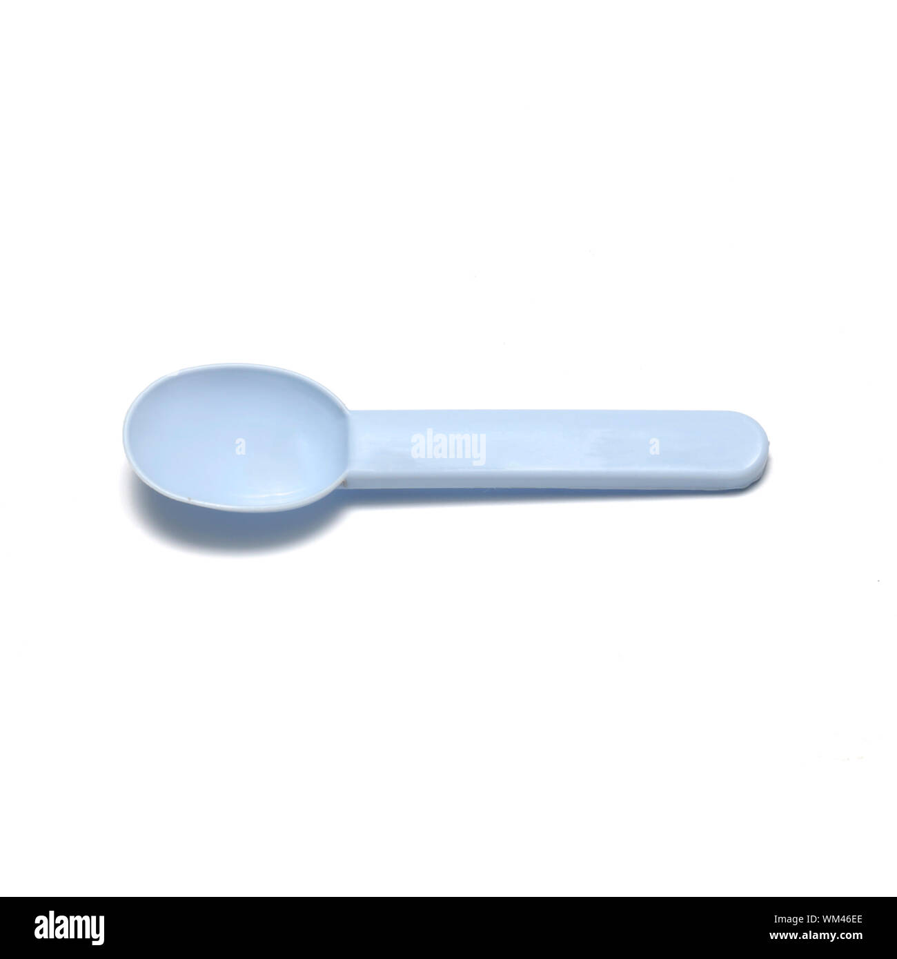 blue plastic spoon on a white background Stock Photo - Alamy