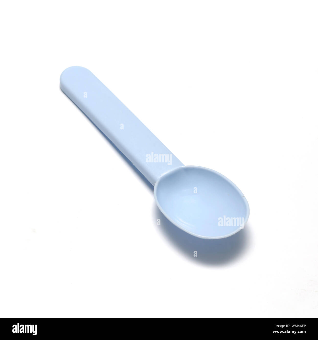 blue plastic spoon on a white background Stock Photo - Alamy