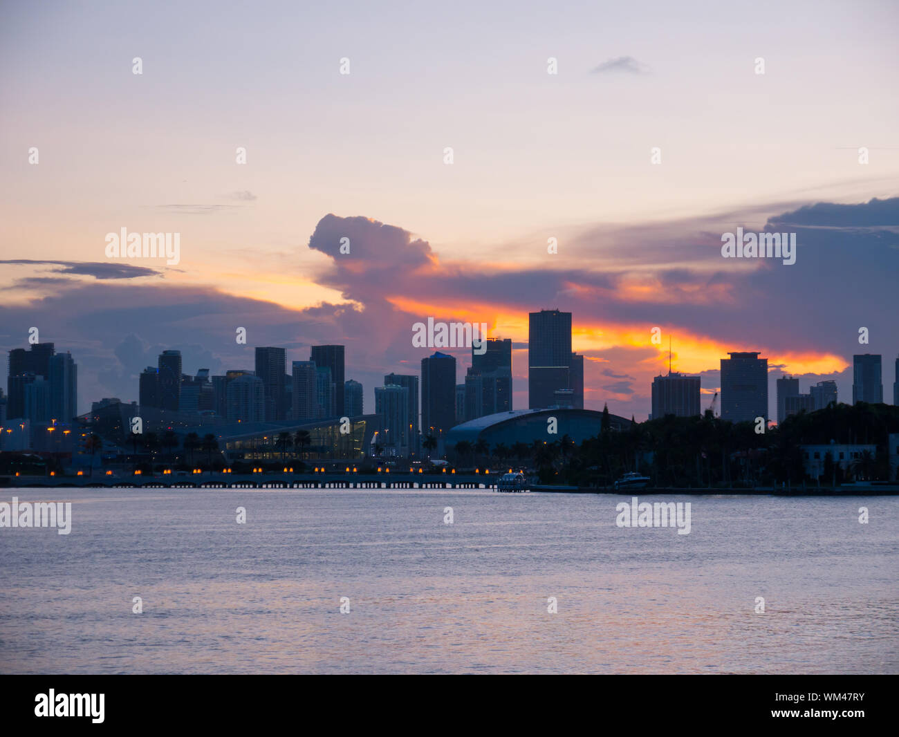 Miami city skyline panorama at dusk with urban skyscrapers and bridge ...