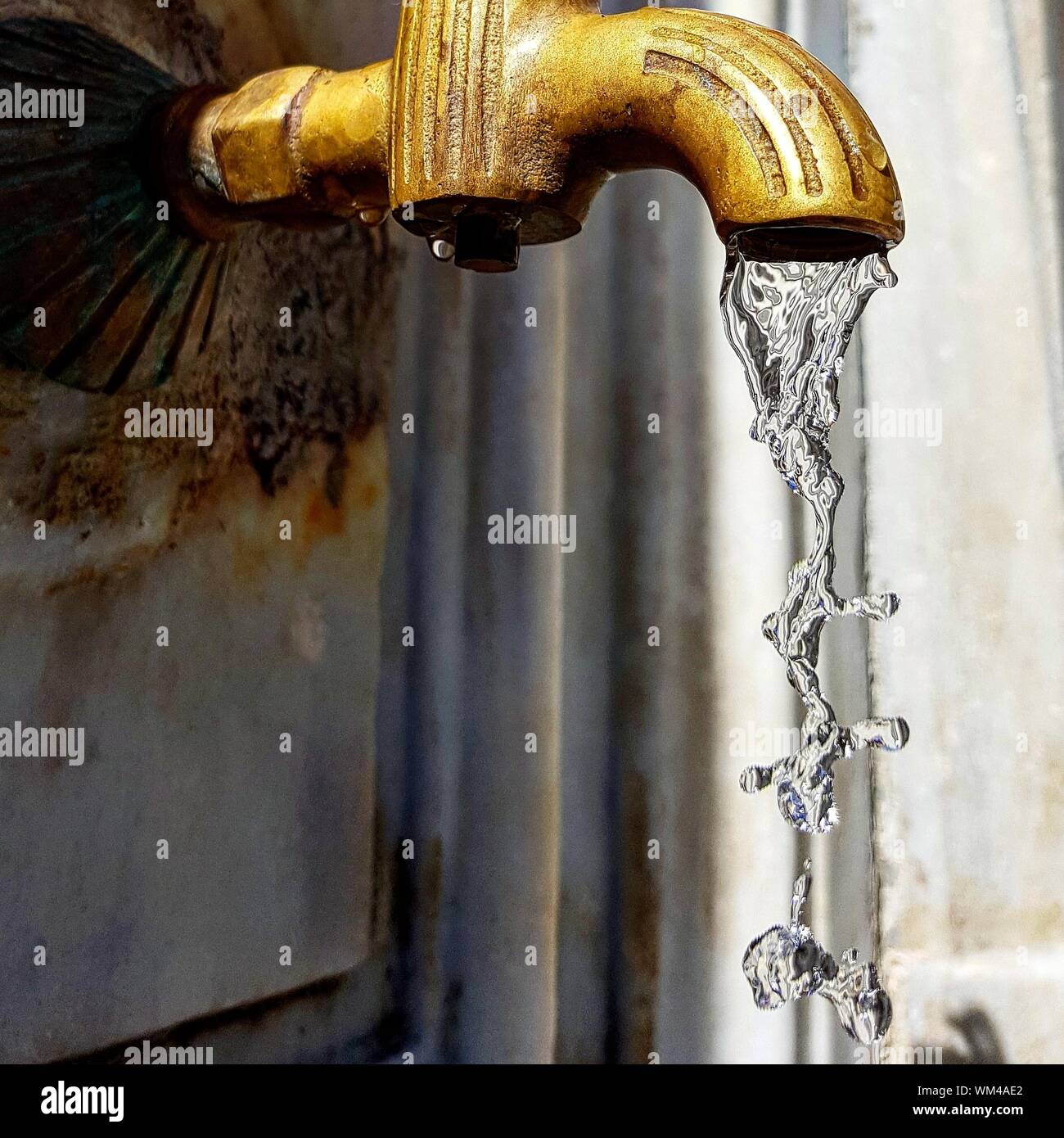 Water drop falling from tap hi-res stock photography and images - Alamy