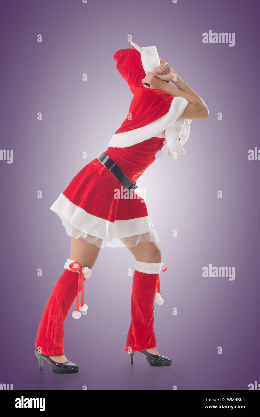 Christmas girl pull something, full length portrait Stock Photo - Alamy
