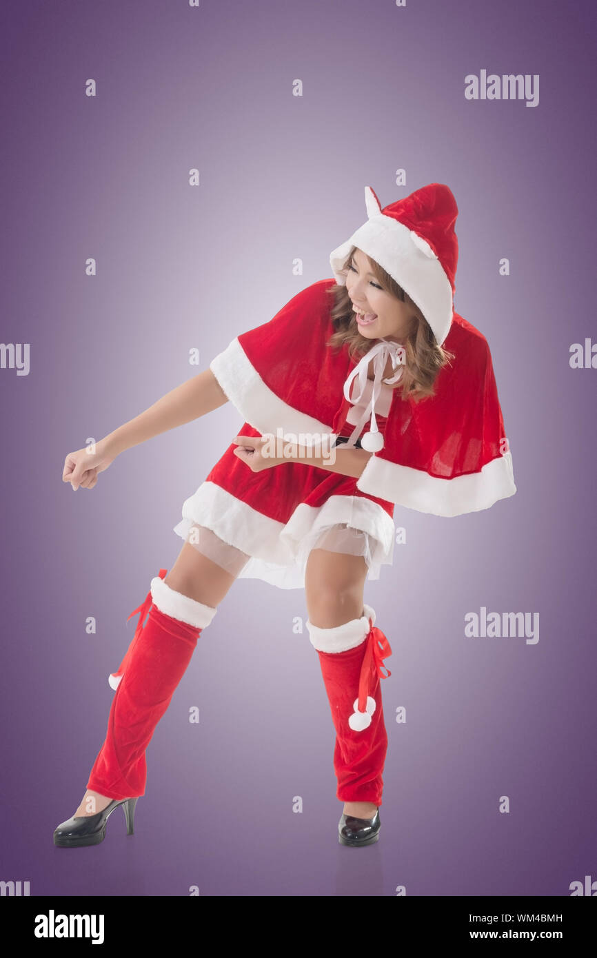 Christmas girl pull something, full length portrait Stock Photo - Alamy