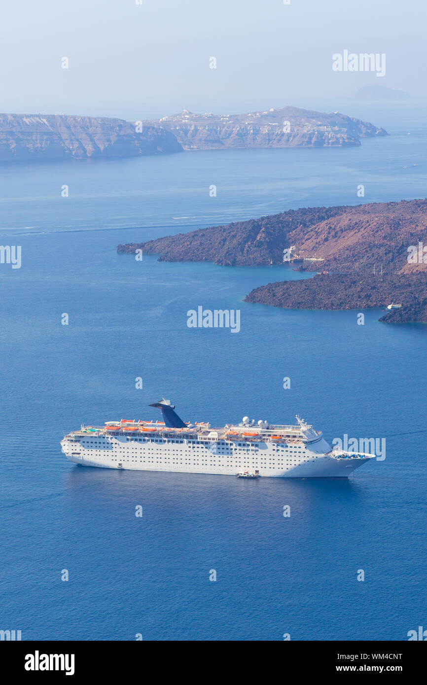 Luxury cruise ship sailing around Santorini island, Aegean sea in ...
