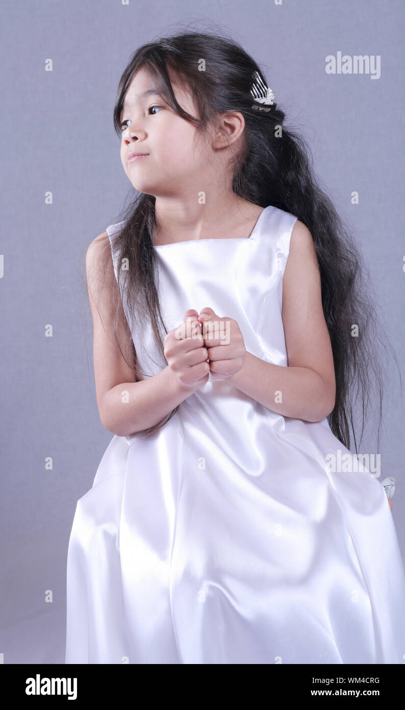 Child sitting patiently Stock Photo - Alamy