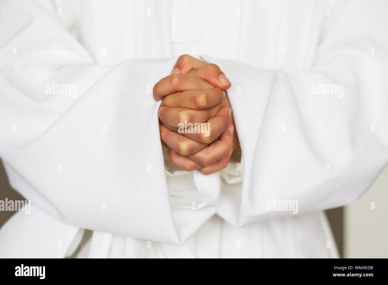 Praying hands priest hi-res stock photography and images - Alamy