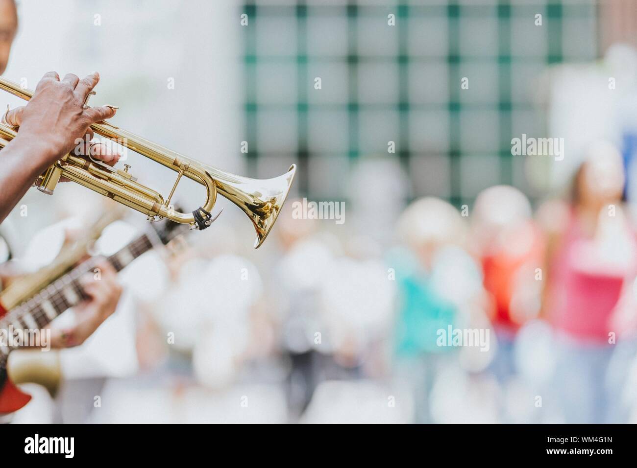 Playing trumpet one hand hi-res stock photography and images - Alamy