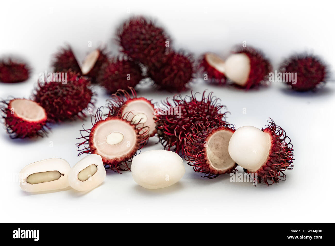Hairy tropical exotic rambutan fruit, whole, half, cut, seed, flesh ...