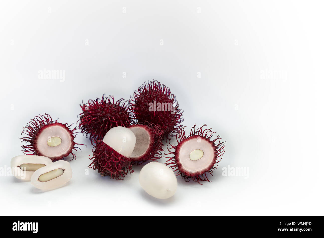 Hairy tropical exotic rambutan fruit, whole, half, cut, seed, flesh ...