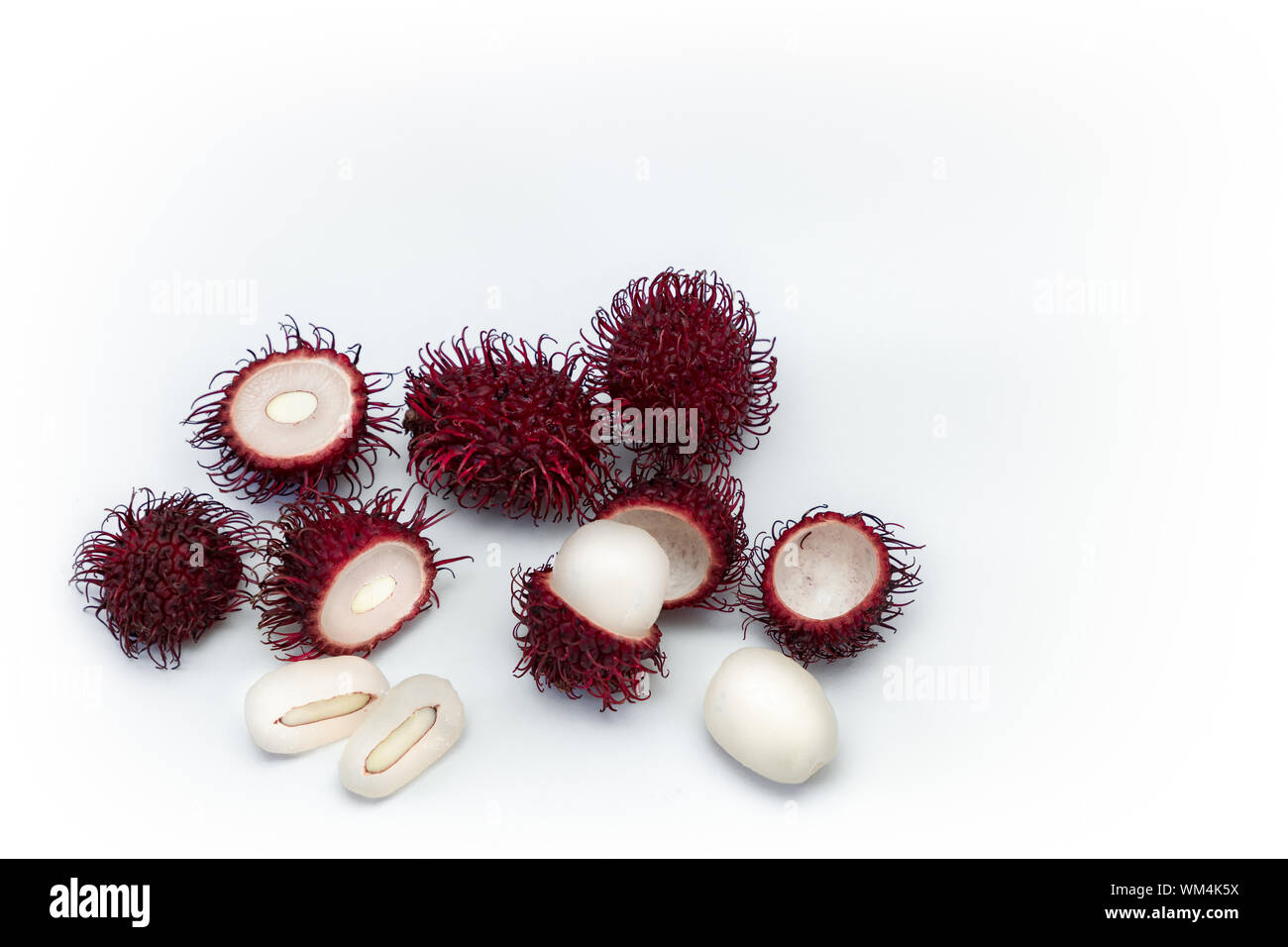 Hairy tropical exotic rambutan fruit, whole, half, cut, seed, flesh ...