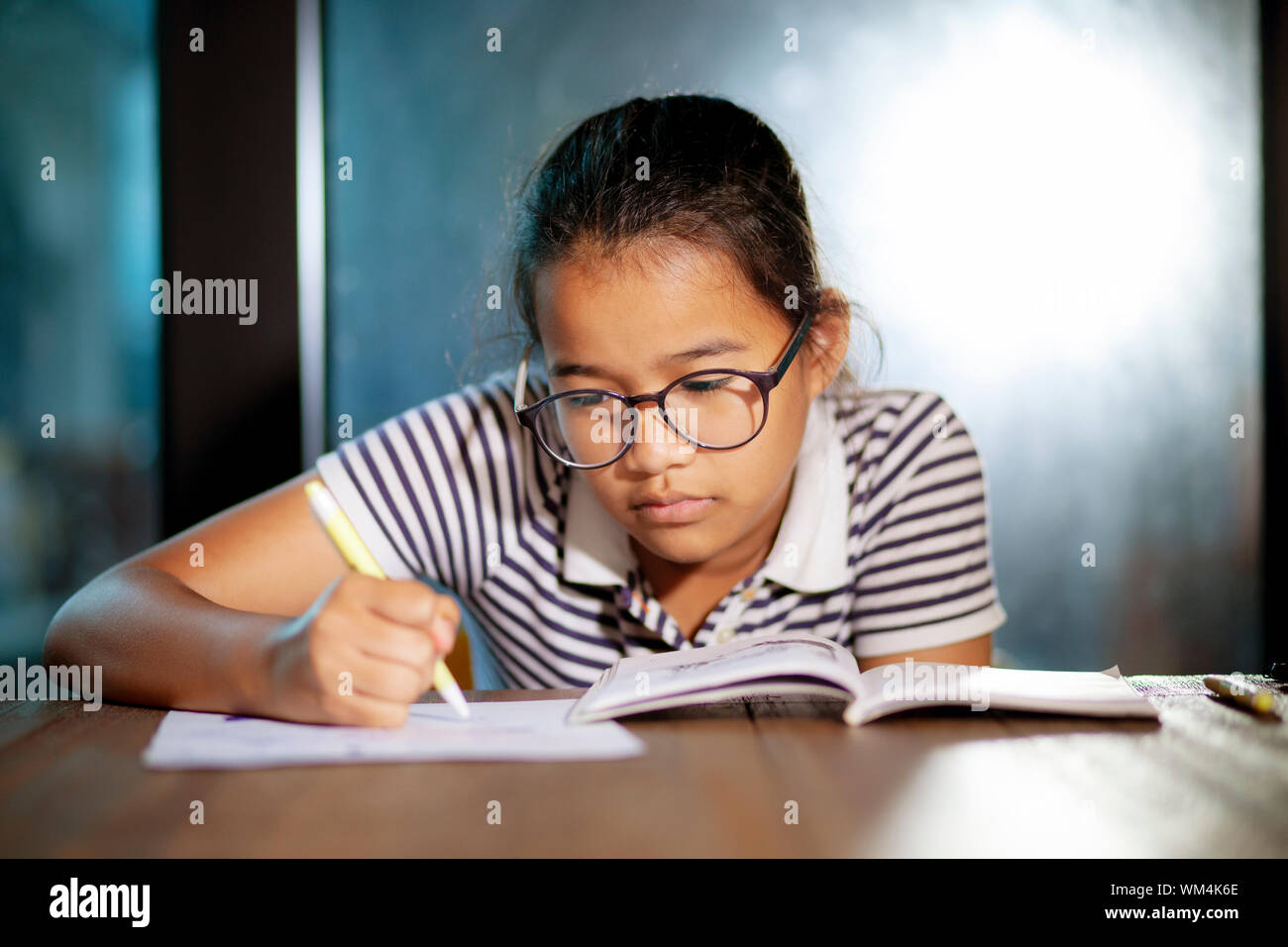 asian teenager doing school homework Stock Photo - Alamy