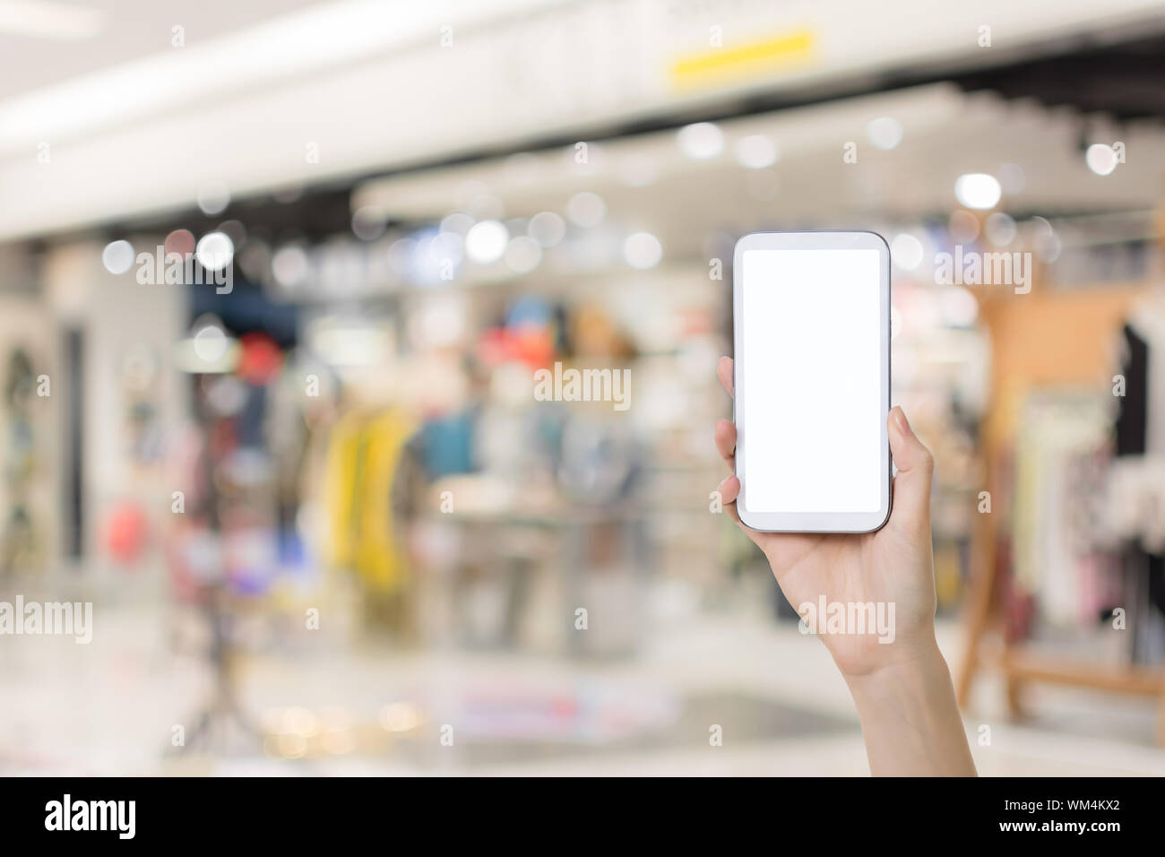 Using smartphone in a market or department store, closeup image Stock ...