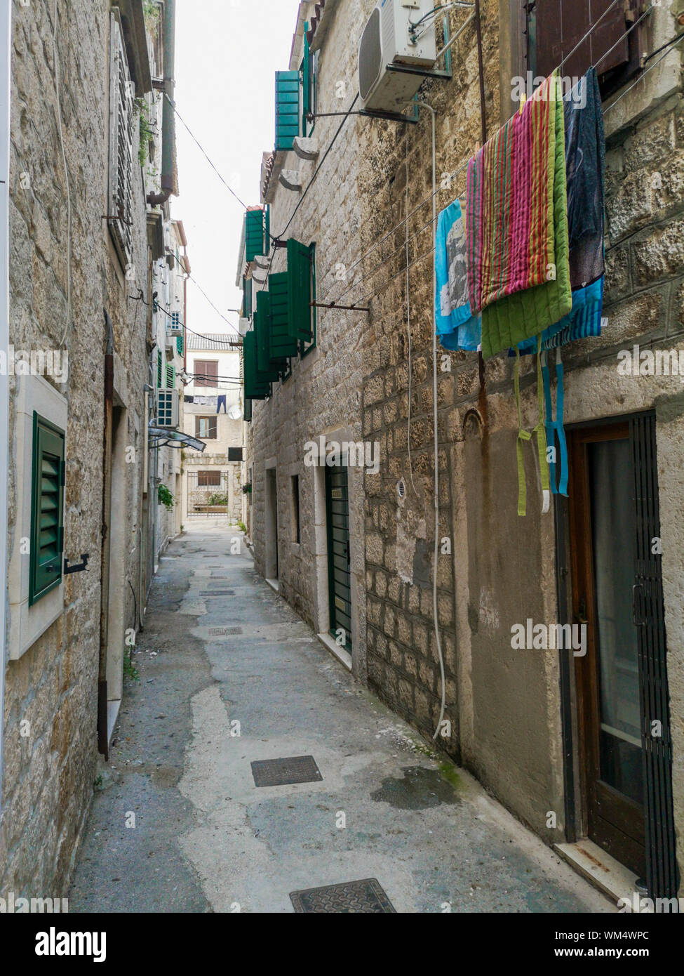 charming alley among historic tenement houses Stock Photo - Alamy