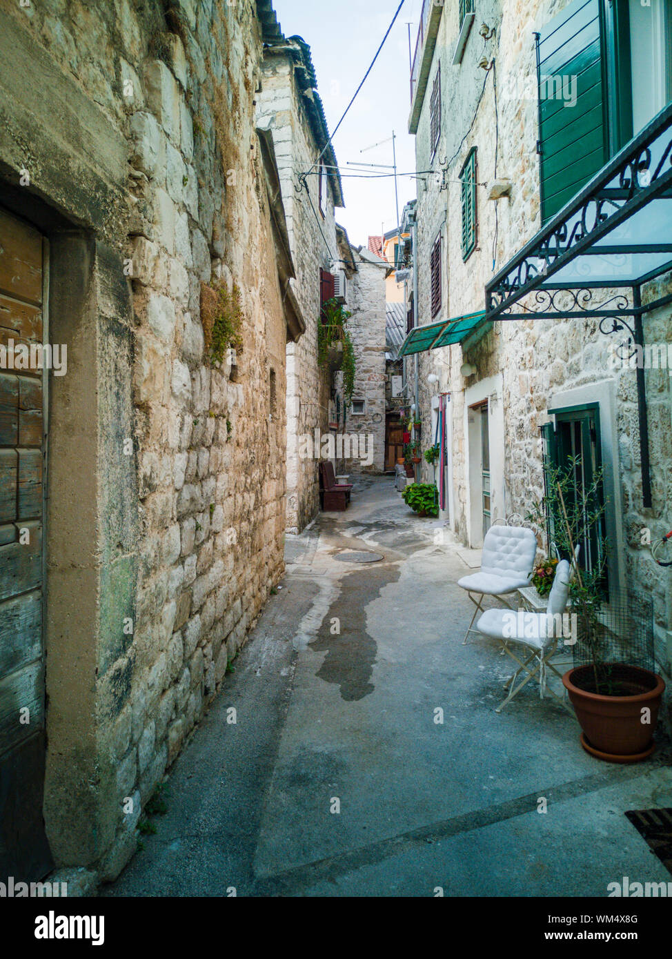 narrow street between historic tenements Stock Photo - Alamy