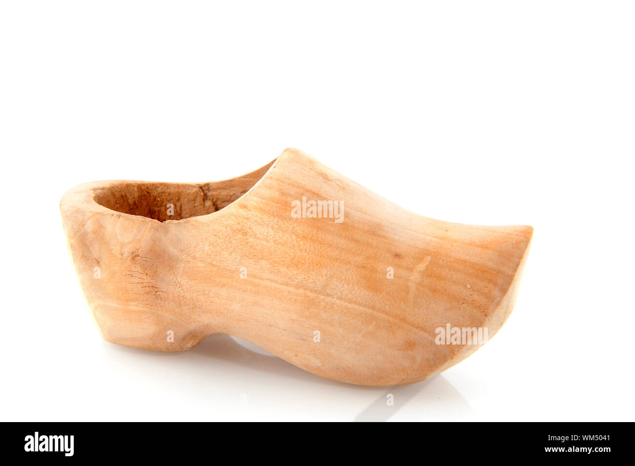 Wooden natural wooden clog isolated over white Stock Photo - Alamy