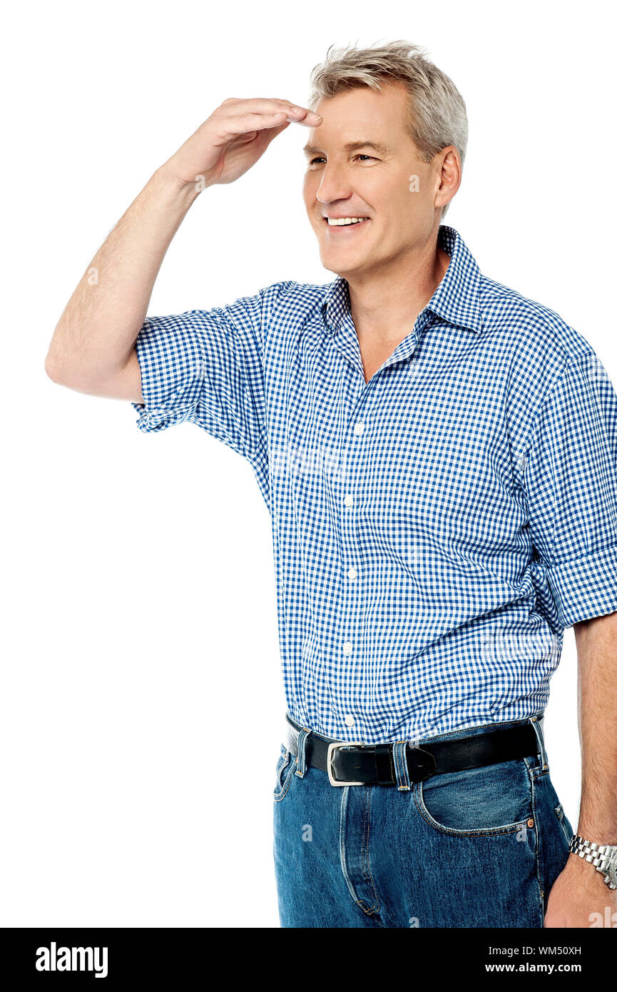Senior man trying to focus the distant object Stock Photo - Alamy