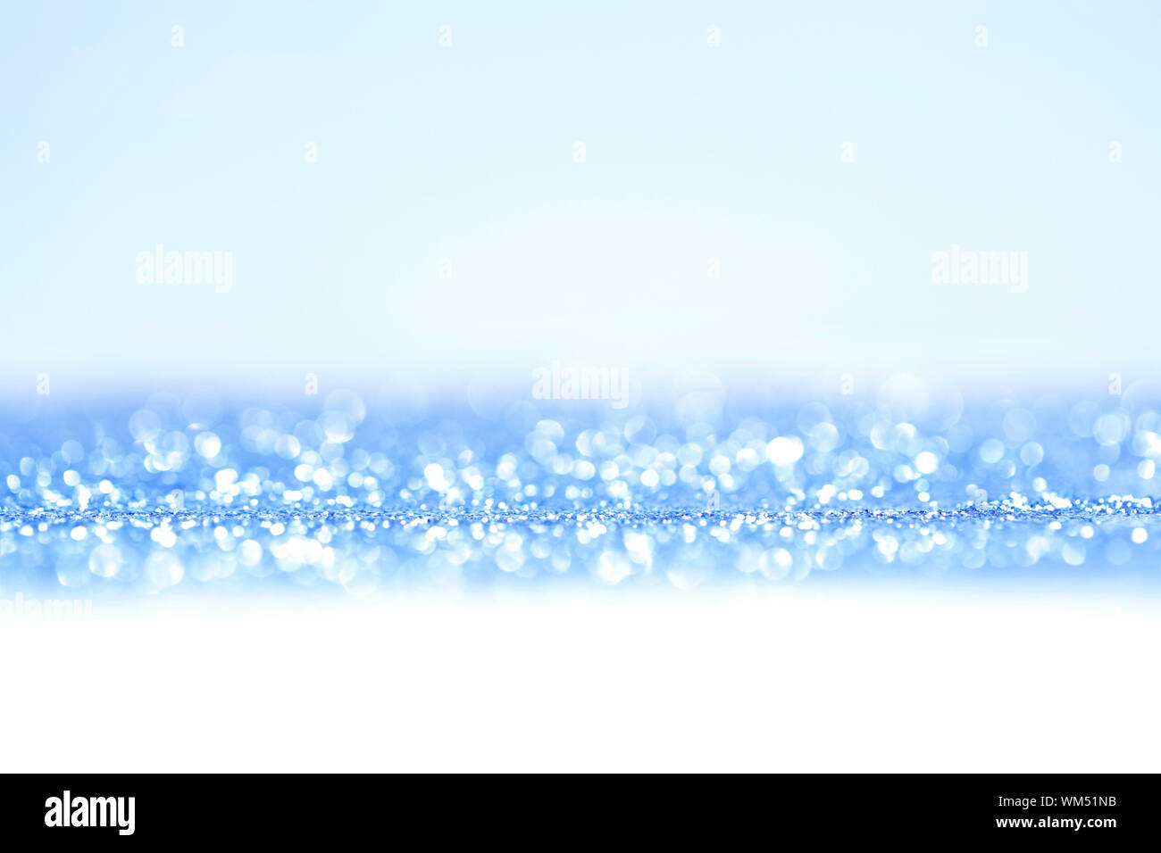 Shiny abstract blue defocused glitter background Stock Photo - Alamy Shiny abstract blue defocused glitter background Stock Photo - Alamy