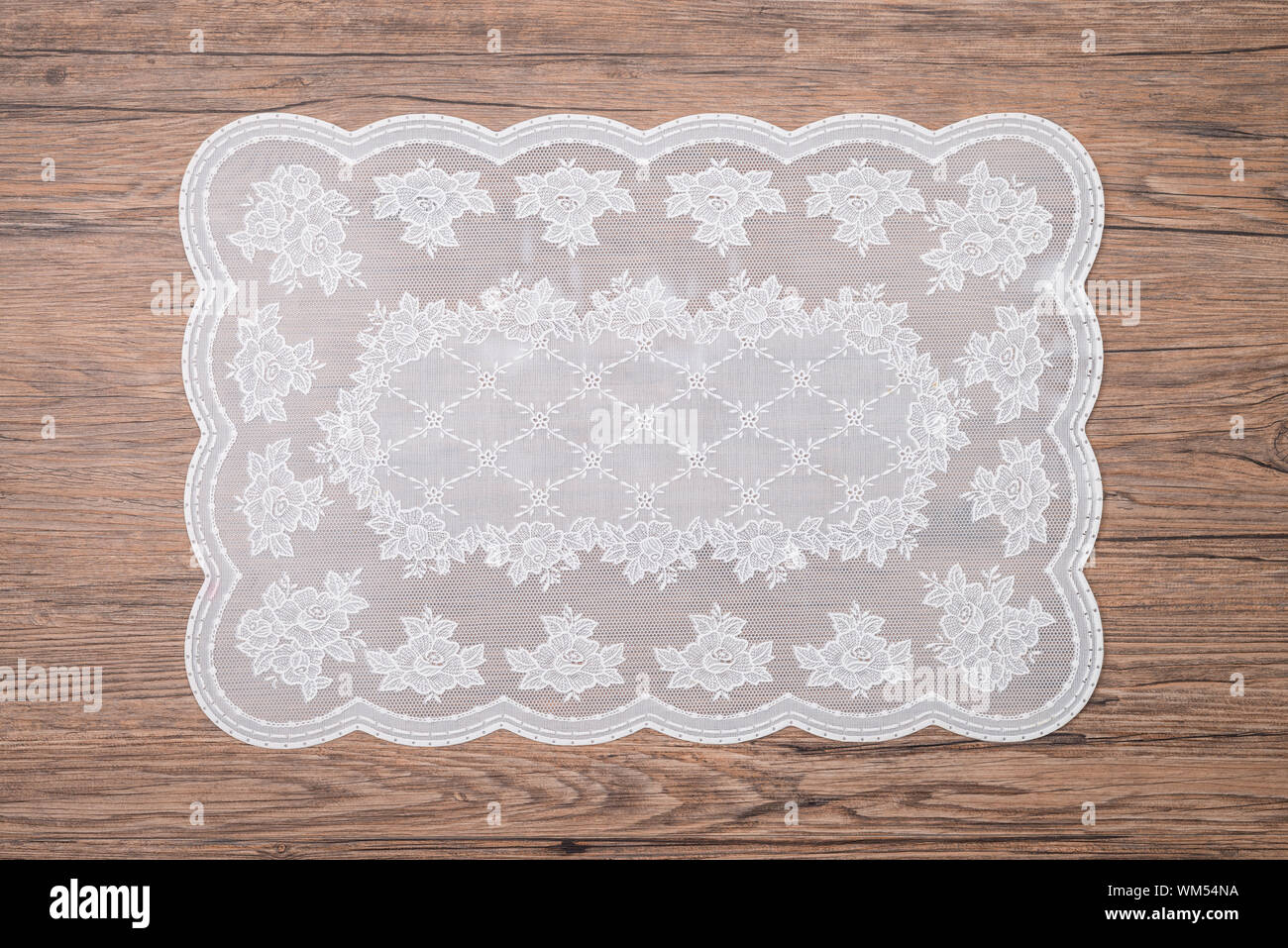 Retro place mat on wooden deck table Stock Photo - Alamy
