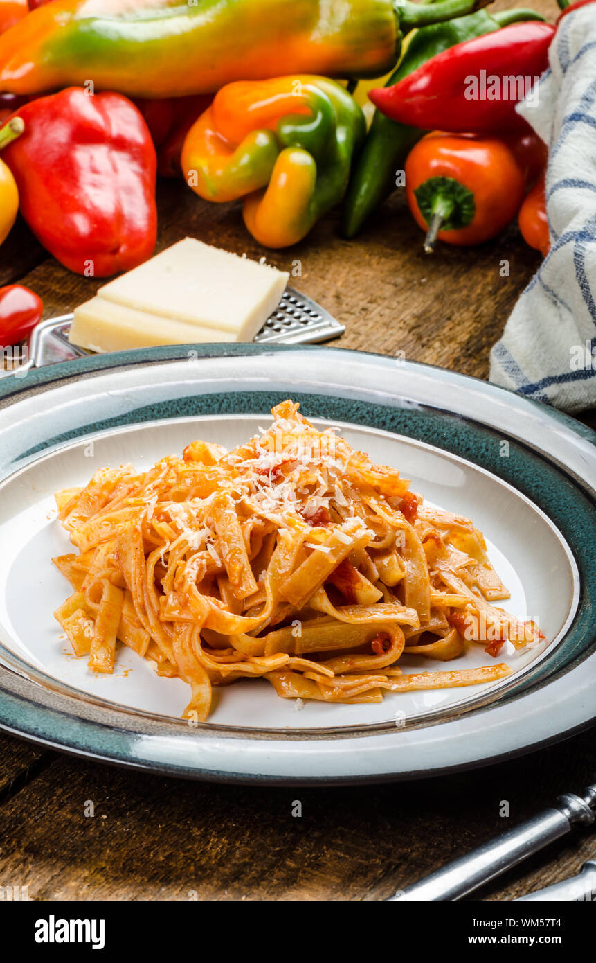 Pasta arrabiata with peppers from bio garden Stock Photo - Alamy