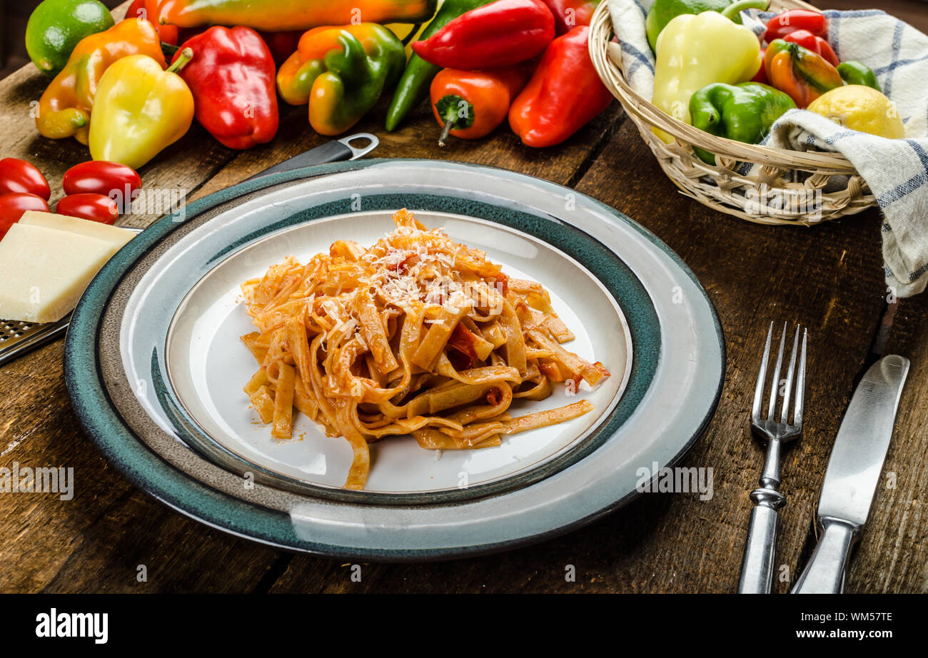 Pasta arrabiata with peppers from bio garden Stock Photo - Alamy