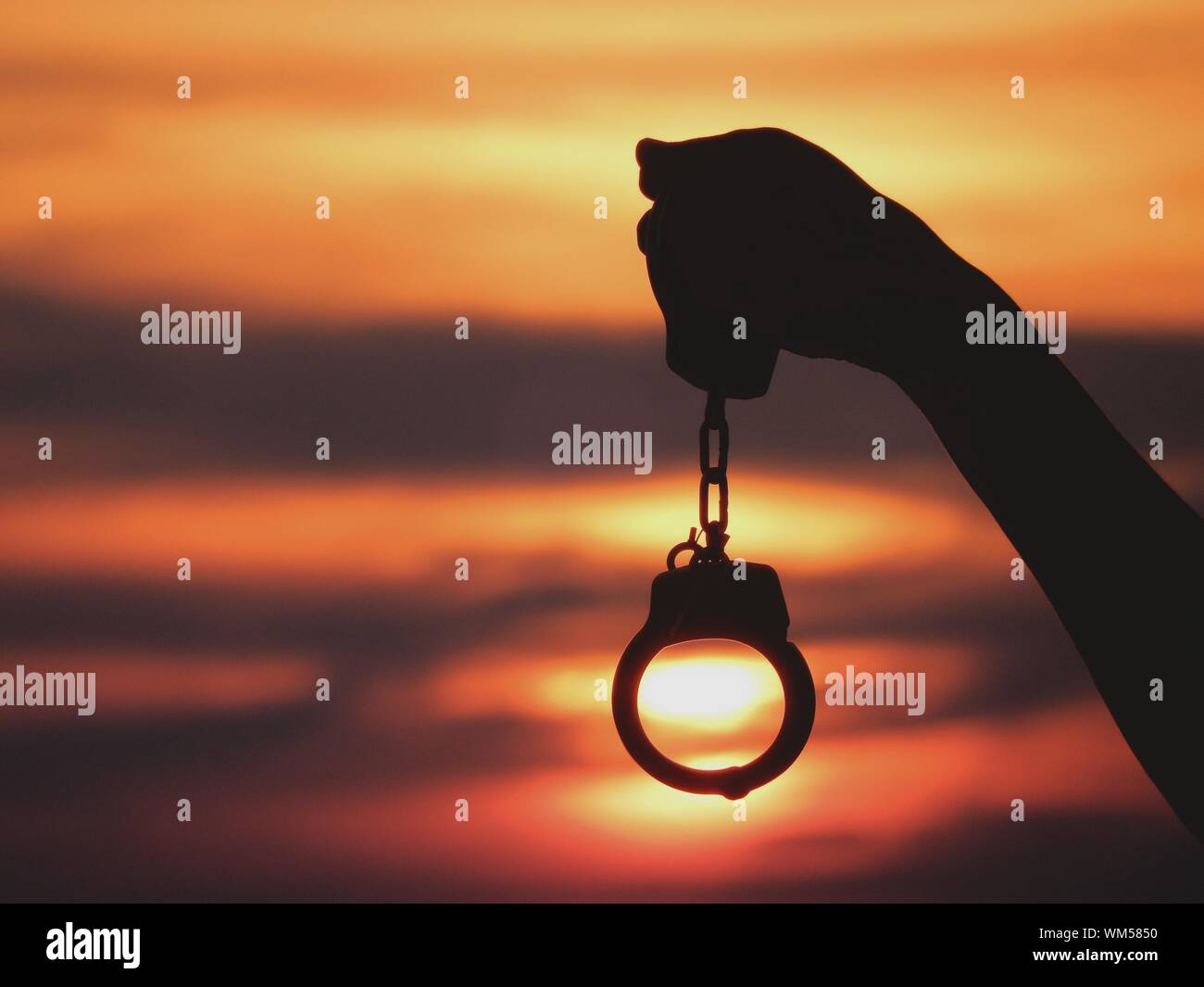 Person in handcuffs hi-res stock photography and images - Alamy