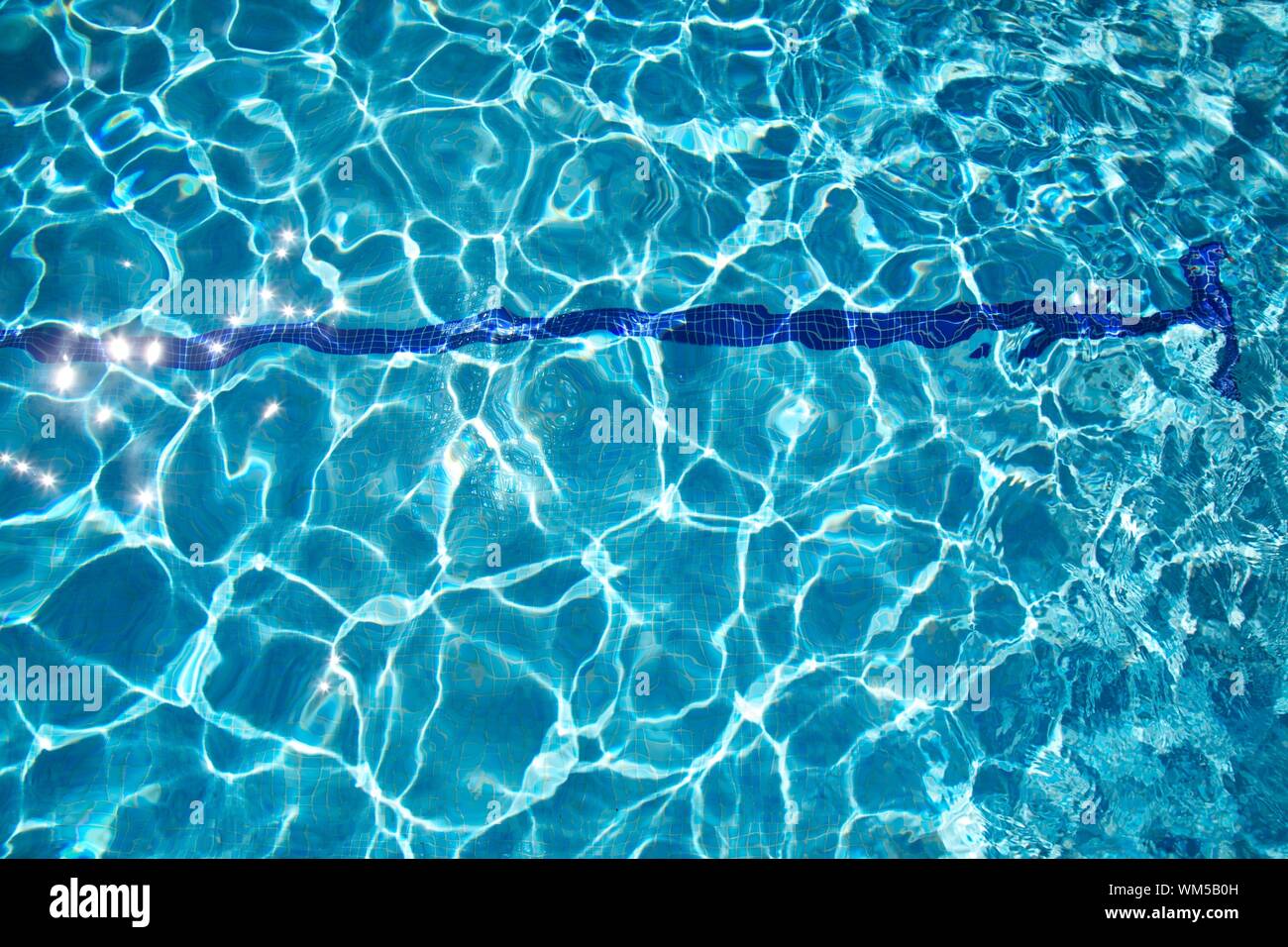 bottom of swimming pool with blue transparent water Stock Photo - Alamy