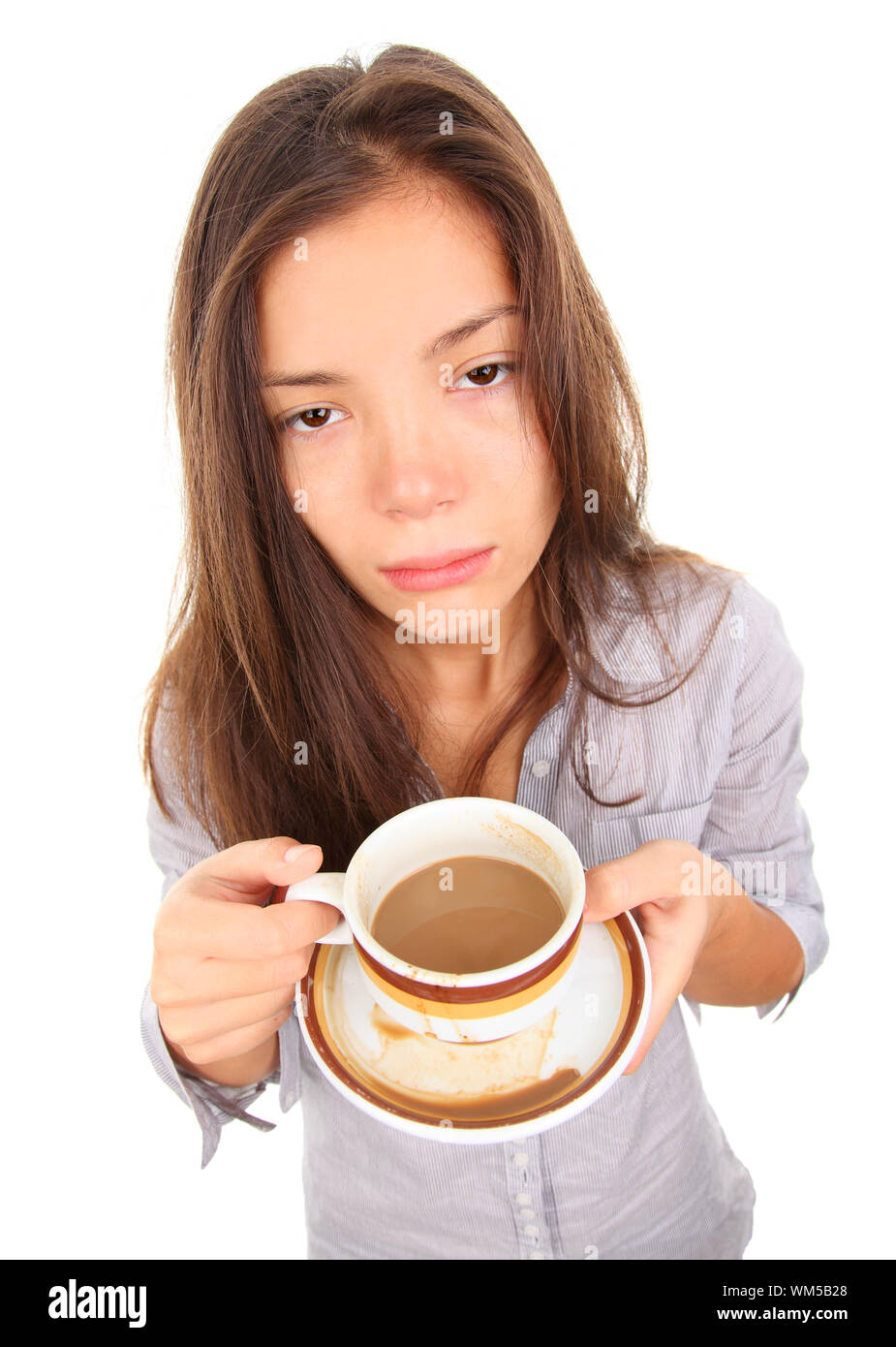 Tired woman with empty and bored eyes looking at the camera having ...