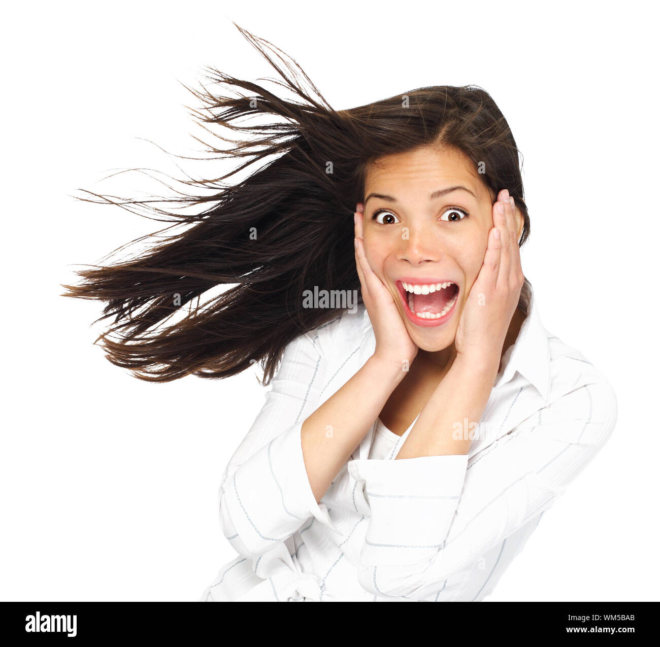 Very Excited Woman Holding Her Head Being Surprised And Looking At The