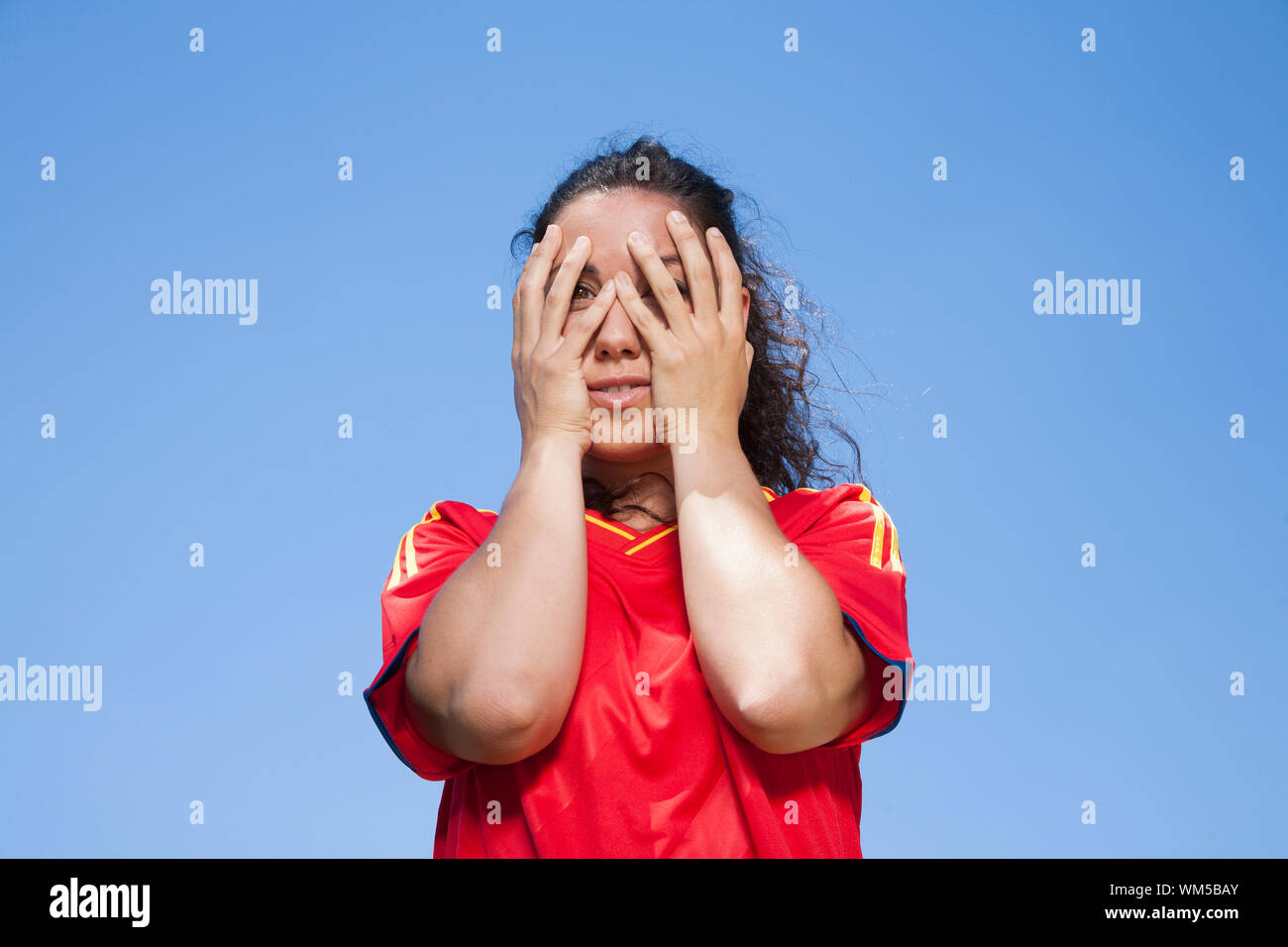 woman with red spanish soccer team shirt scared face Stock Photo - Alamy