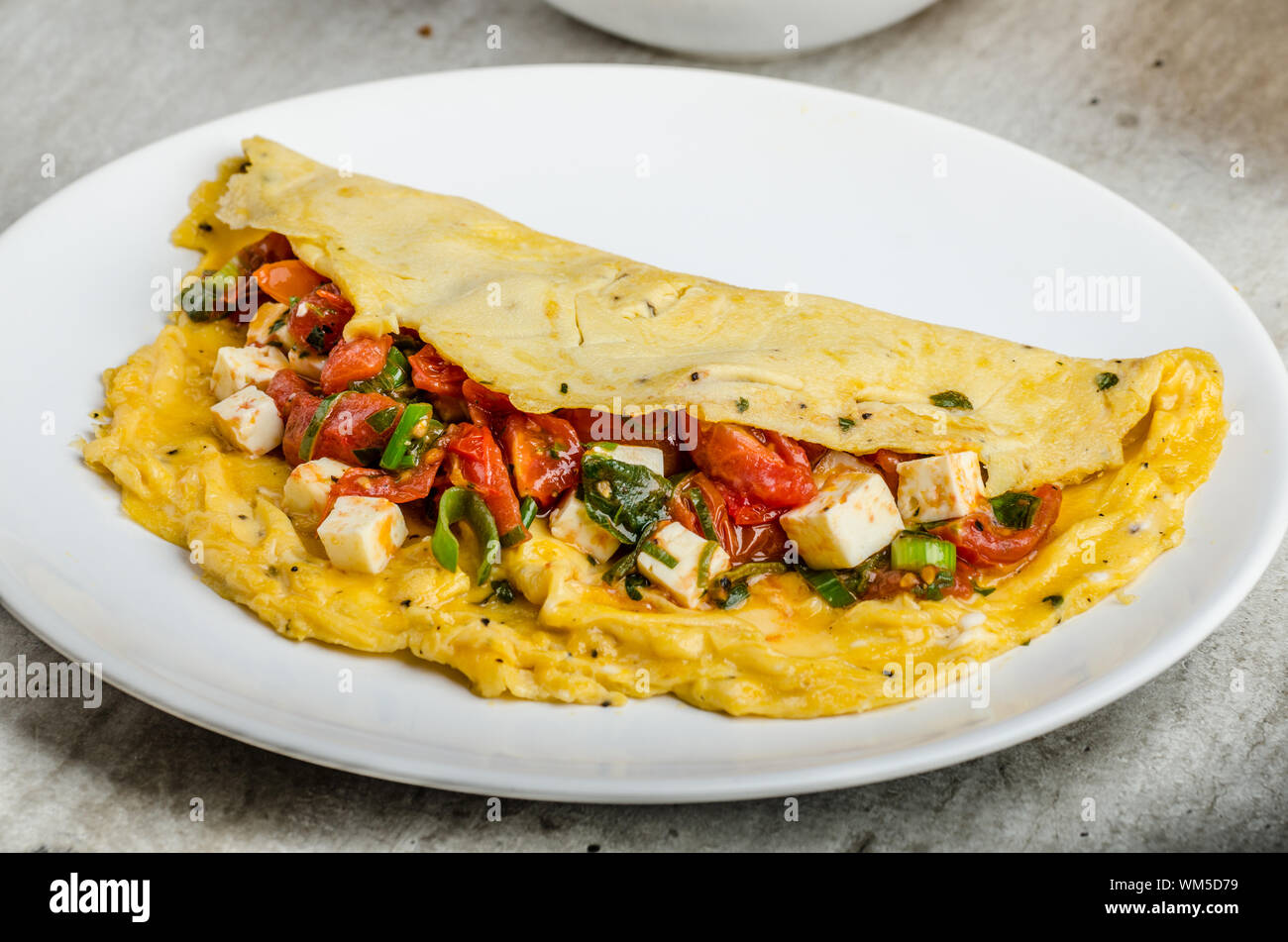 Mediterranean-Style Omlette with crispy garlic bread and apple juice ...