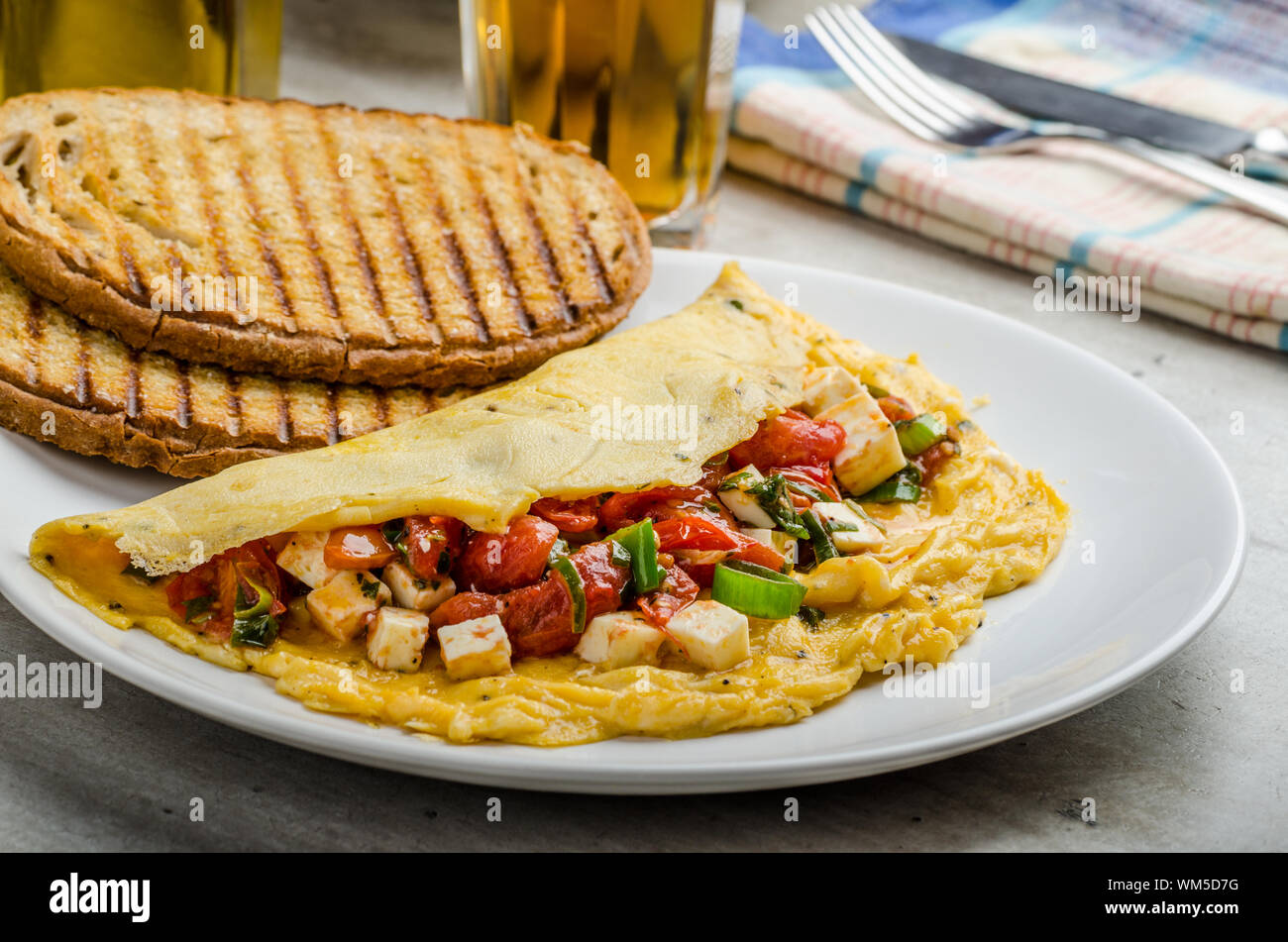 Mediterranean-Style Omlette with crispy garlic bread and apple juice ...
