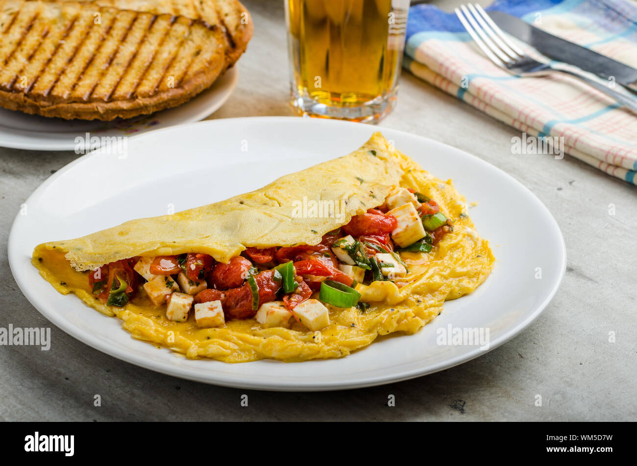 Mediterranean-Style Omlette with crispy garlic bread and apple juice ...