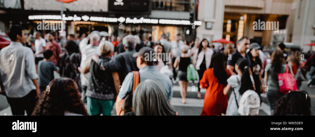 People on street. Panoramic view of crowd walking, crossing the street ...