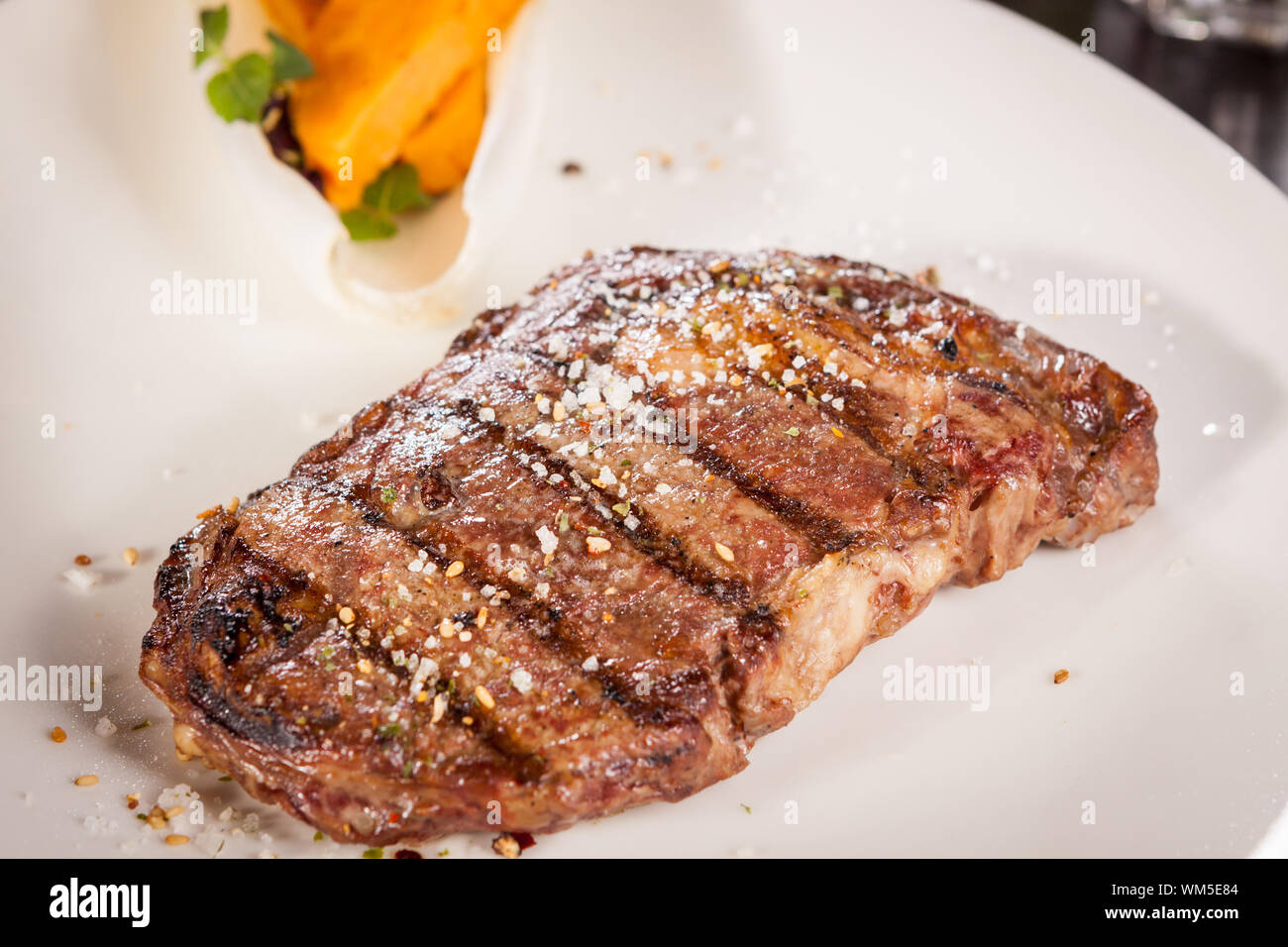 Grilled beef steak with seasoning Stock Photo - Alamy